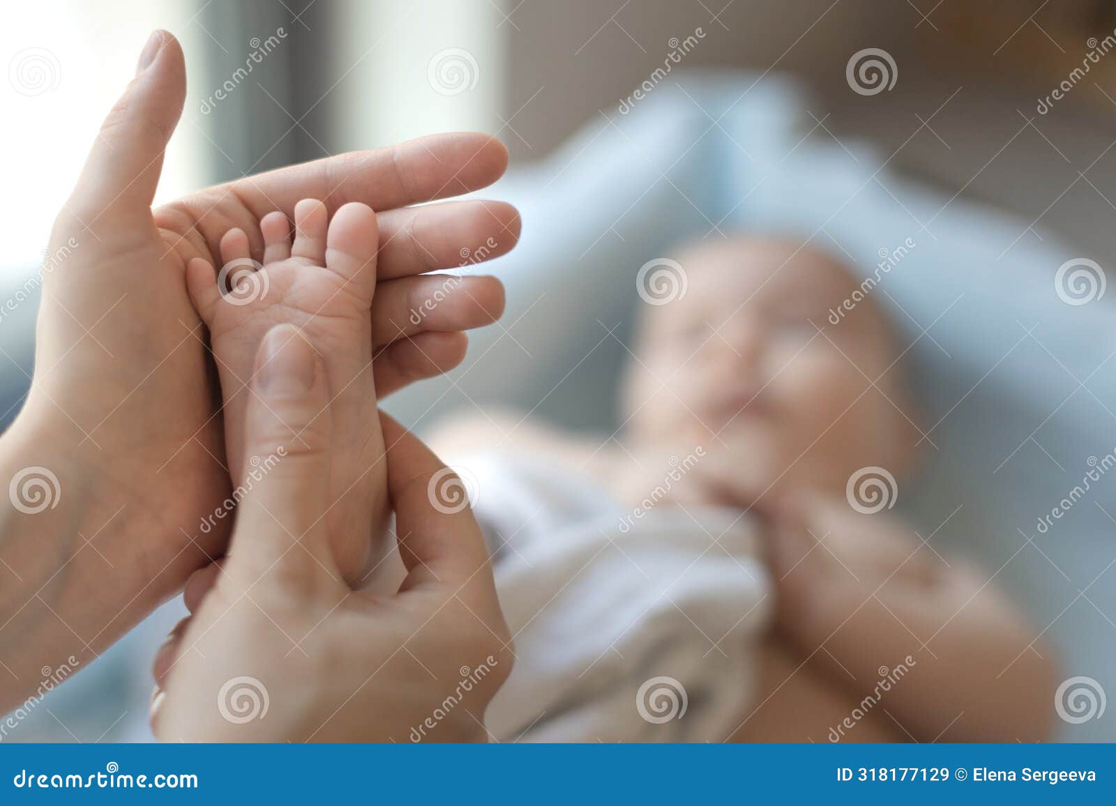 Doctor Examining a Baby, Checking the Reflexes of the Newborn Stock ...