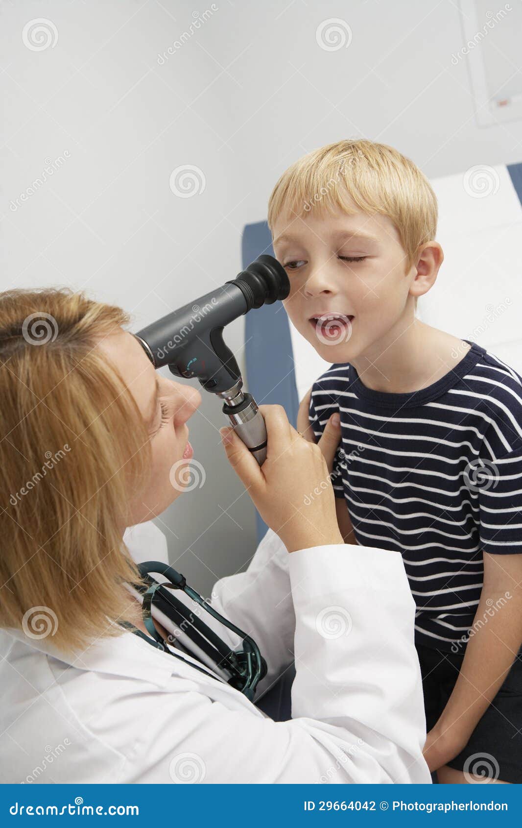 Doctor Examining Boy s Eye stock photo. Image of holding - 29664042