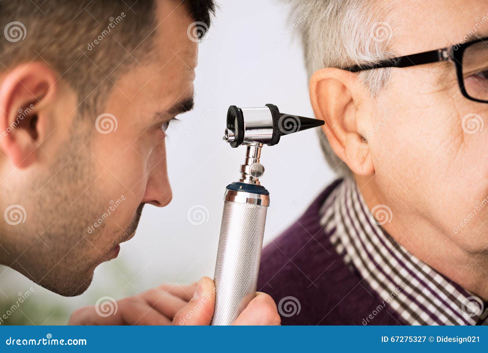 Doctor Examining Ear of a Patient Stock Image - Image of male, otoscope ...