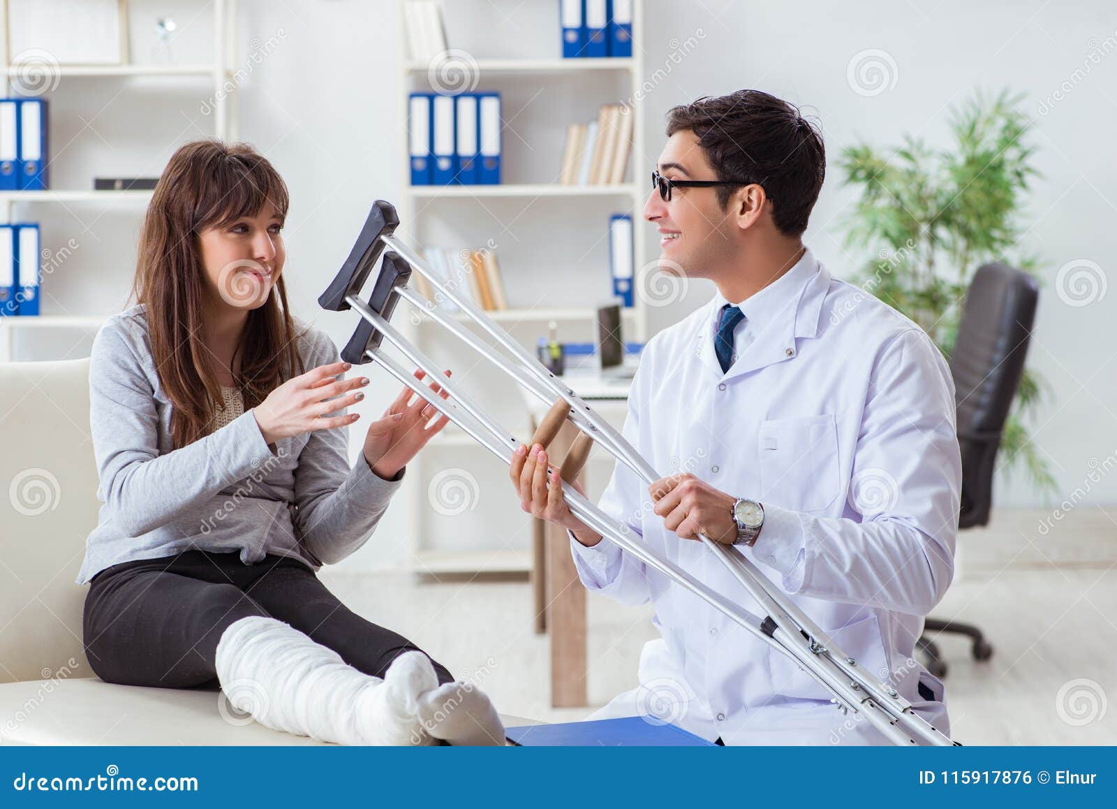 The Doctor Examining Patient with Broken Leg Stock Photo - Image of ...