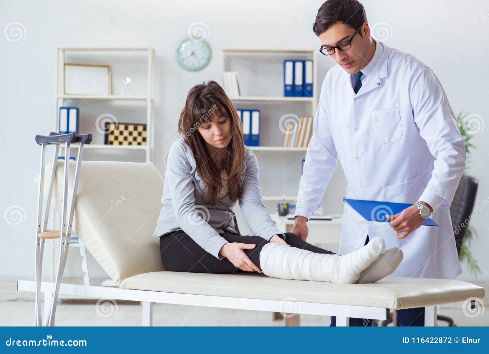 The Doctor Examining Patient with Broken Leg Stock Photo - Image of ...