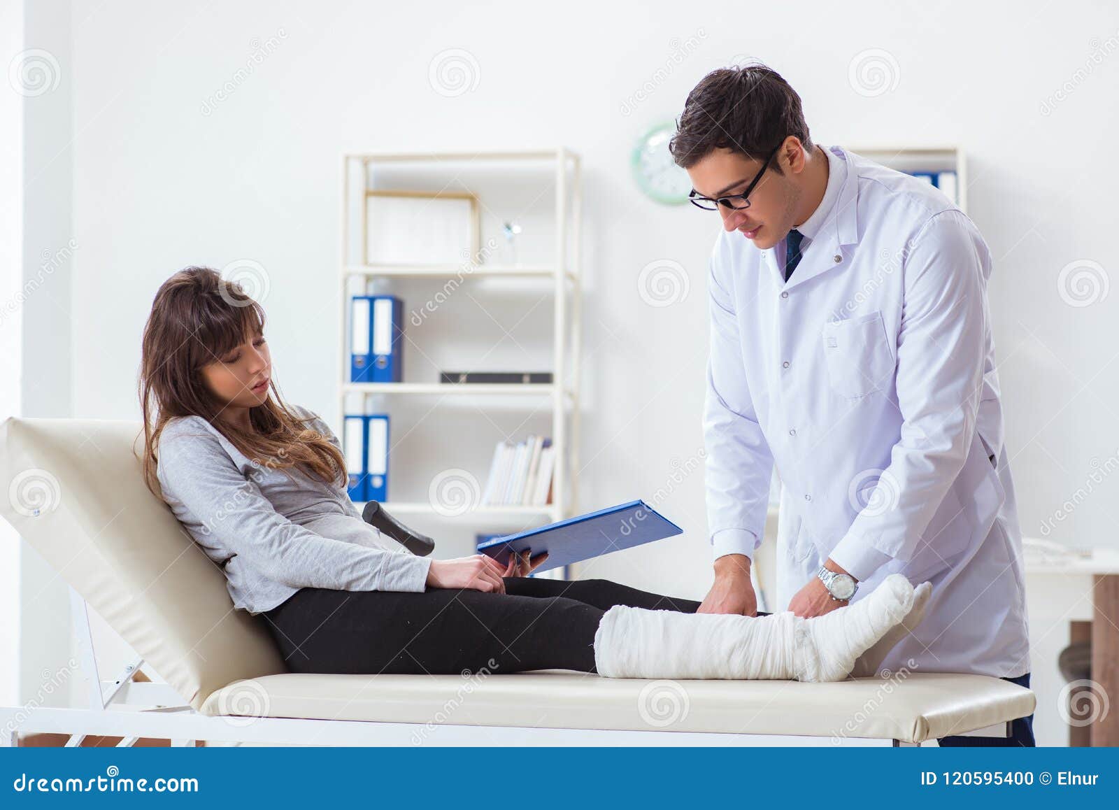 The Doctor Examining Patient with Broken Leg Stock Photo - Image of ...