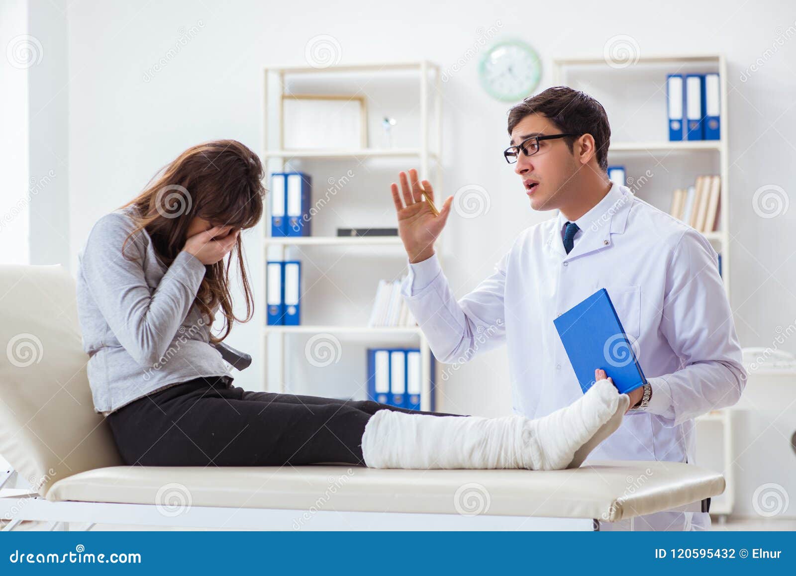 The Doctor Examining Patient with Broken Leg Stock Photo - Image of ...
