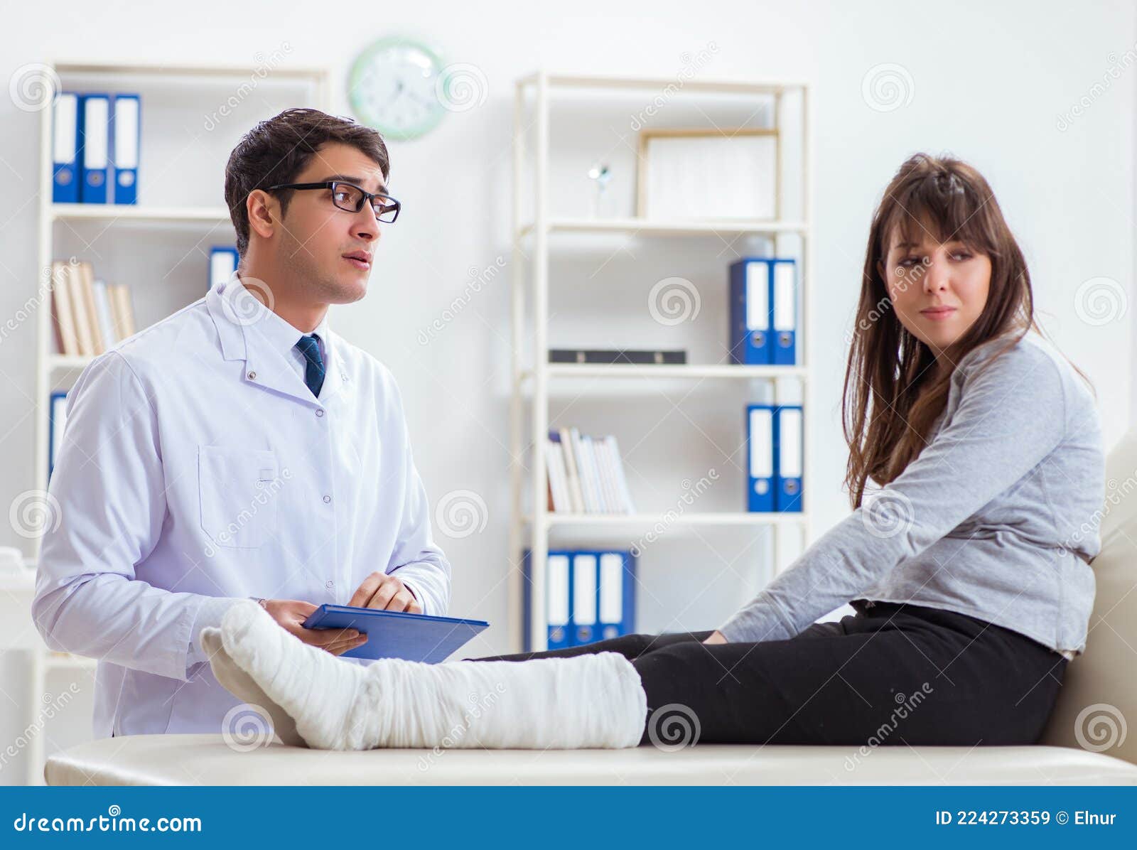 Doctor Examining Patient with Broken Leg Stock Image - Image of medical ...