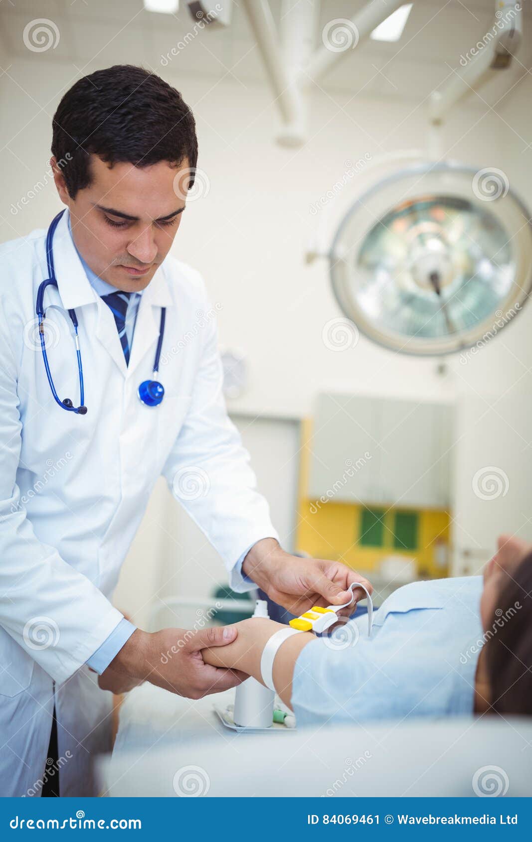 Doctor examining a patient stock image. Image of checkup - 84069461