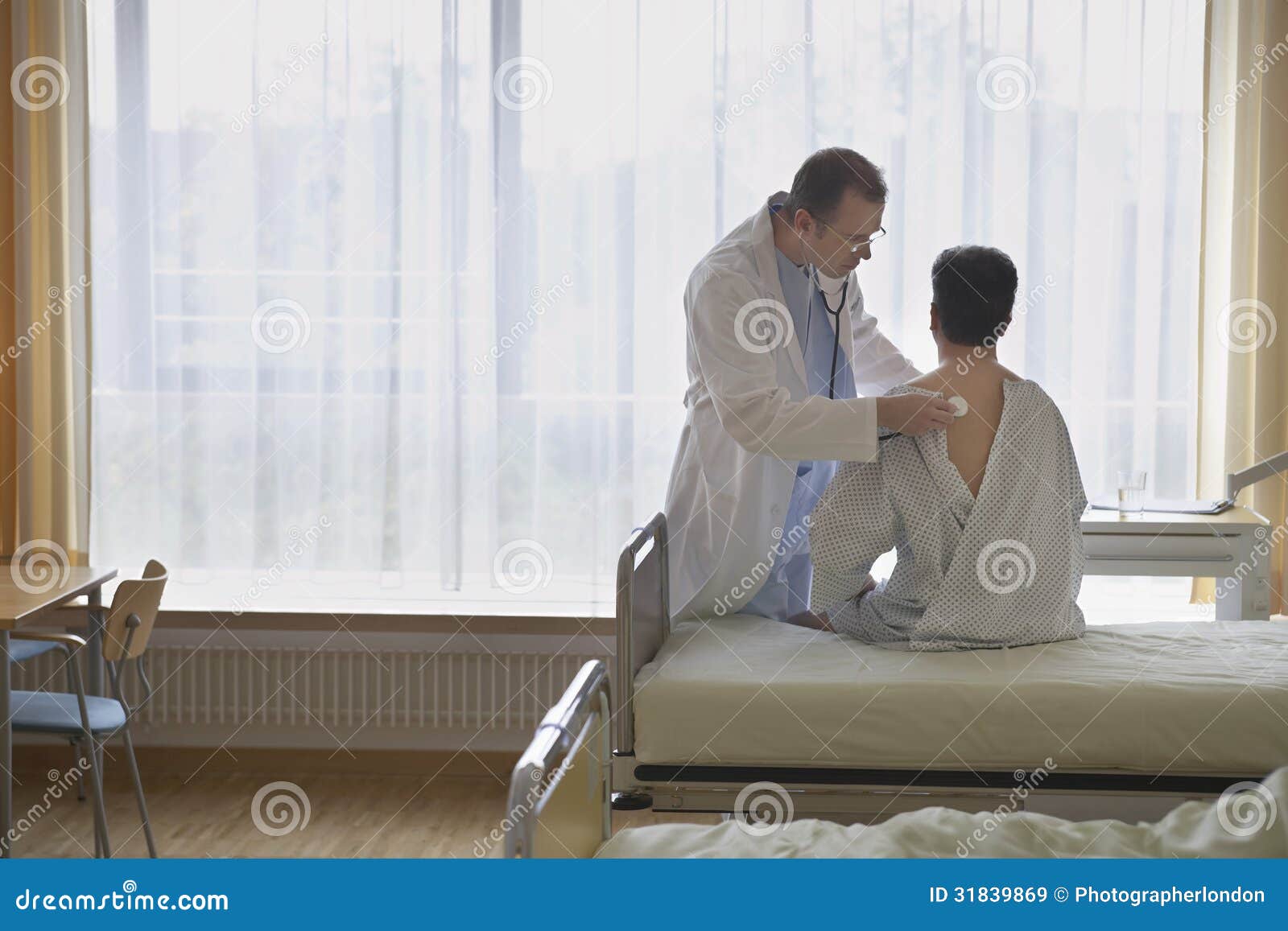 Doctor Examining Patient in Hospital Room Stock Image - Image of ...