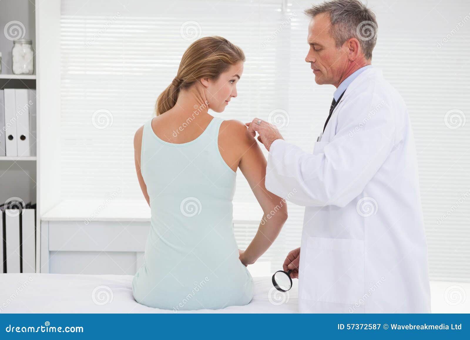 Doctor Examining a Patients Shoulder Stock Image - Image of people ...