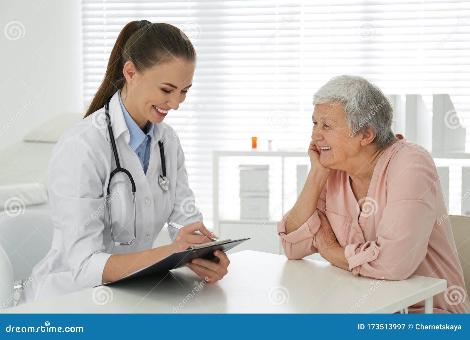 Doctor Examining Senior Patient in Office Stock Image - Image of mature ...