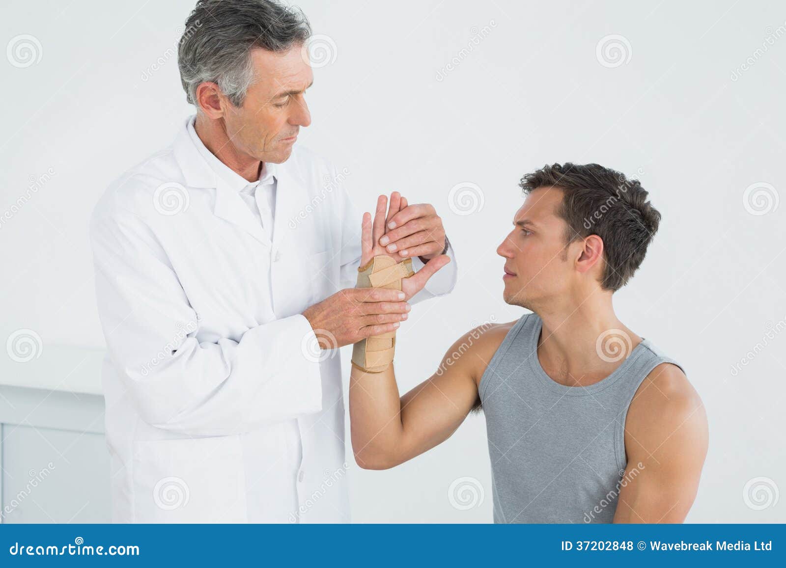 Doctor Examining a Young Patients Hand Stock Photo - Image of adult ...