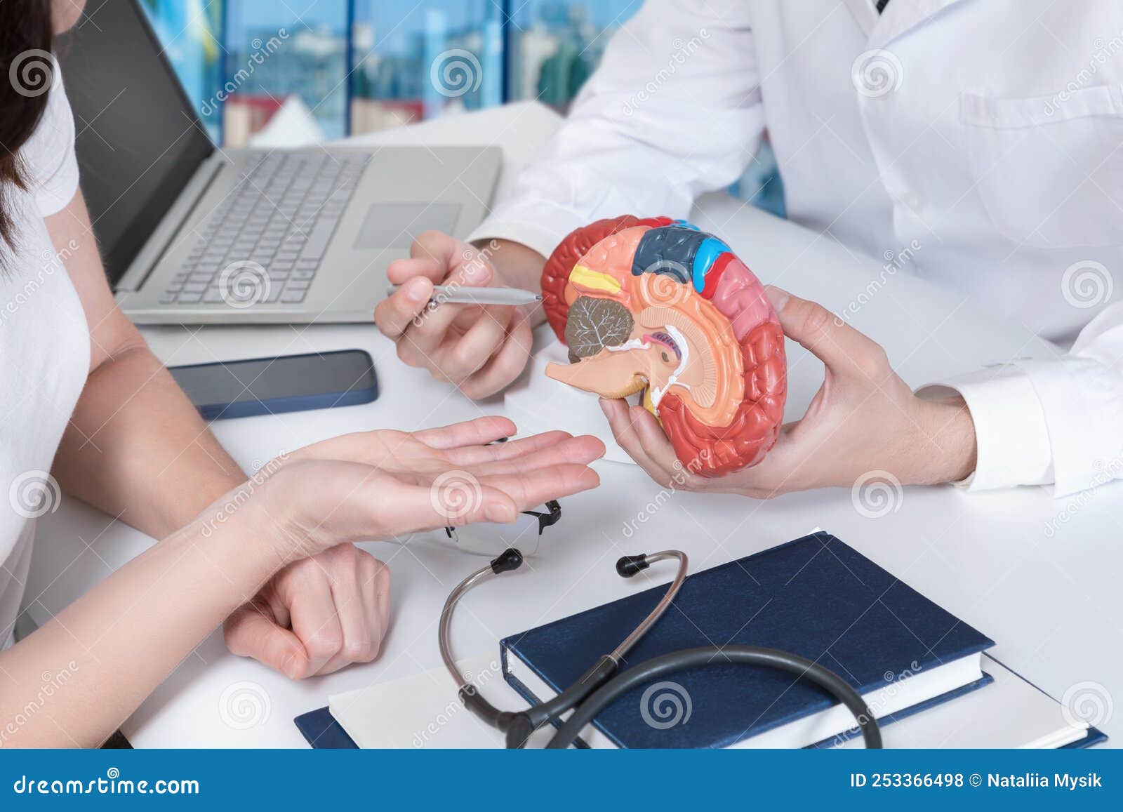 Doctor Explaining Brain Functions To Patient on Model Stock Photo ...