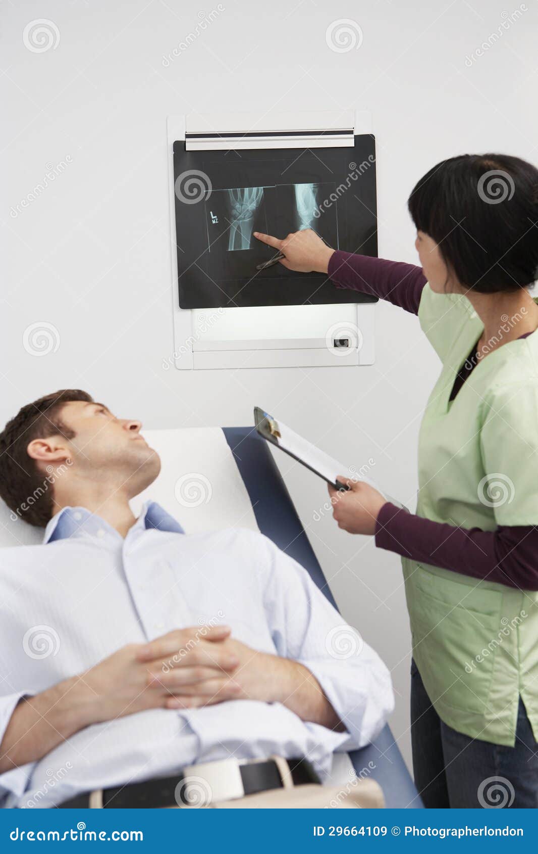 Doctor Explaining the X-ray Report To Male Patient Stock Image - Image ...