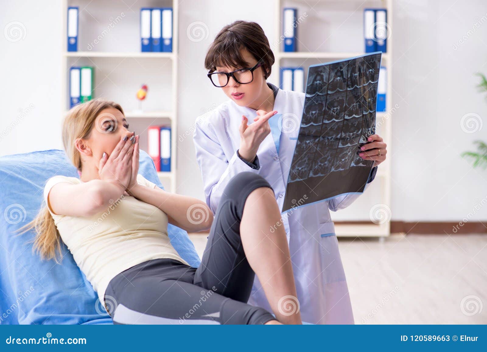 The Doctor Explaining X-ray Scan during Consultation Stock Image ...