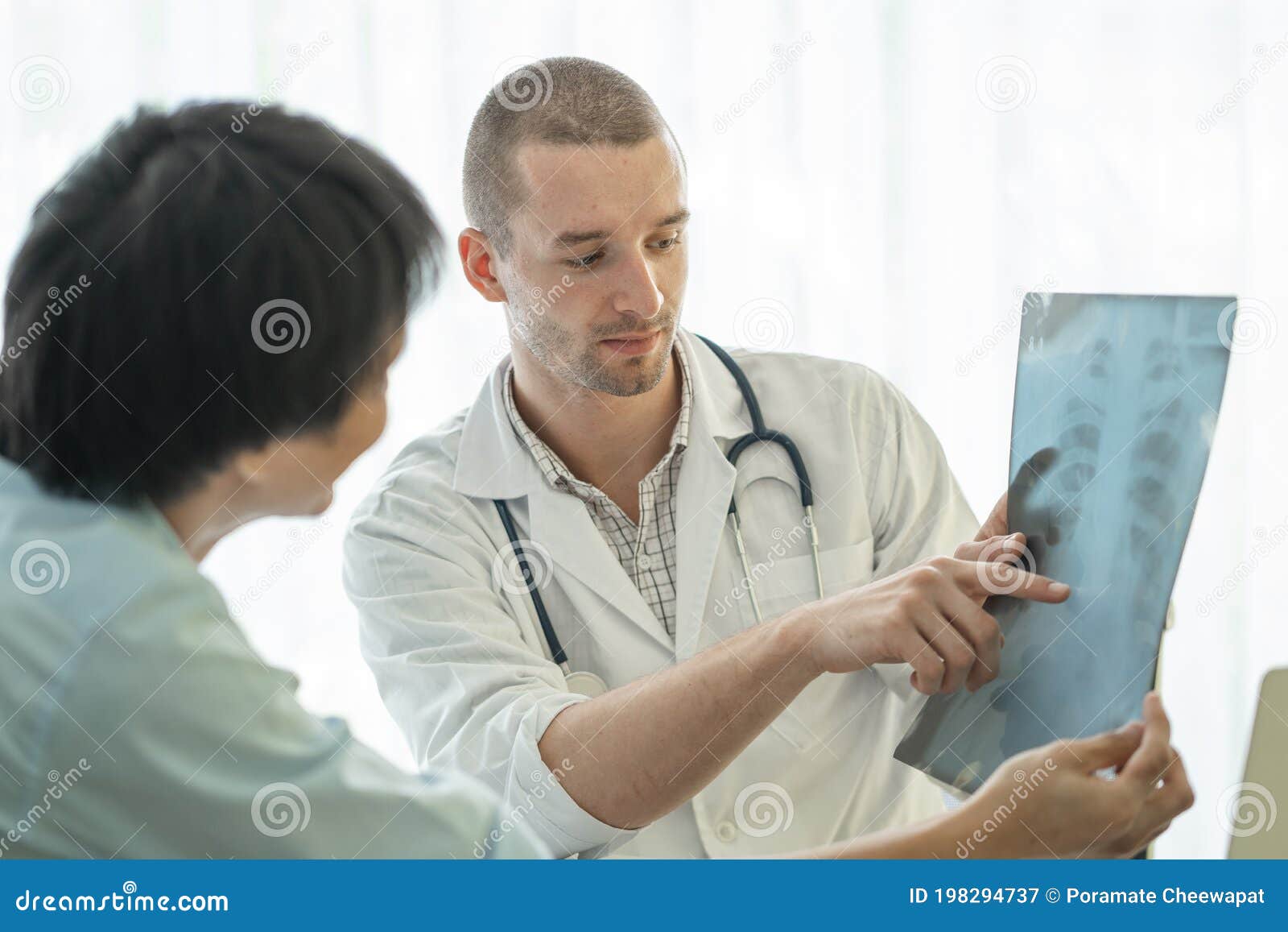 Doctor Explaining Result of Radiography Test To Patient Stock Image ...