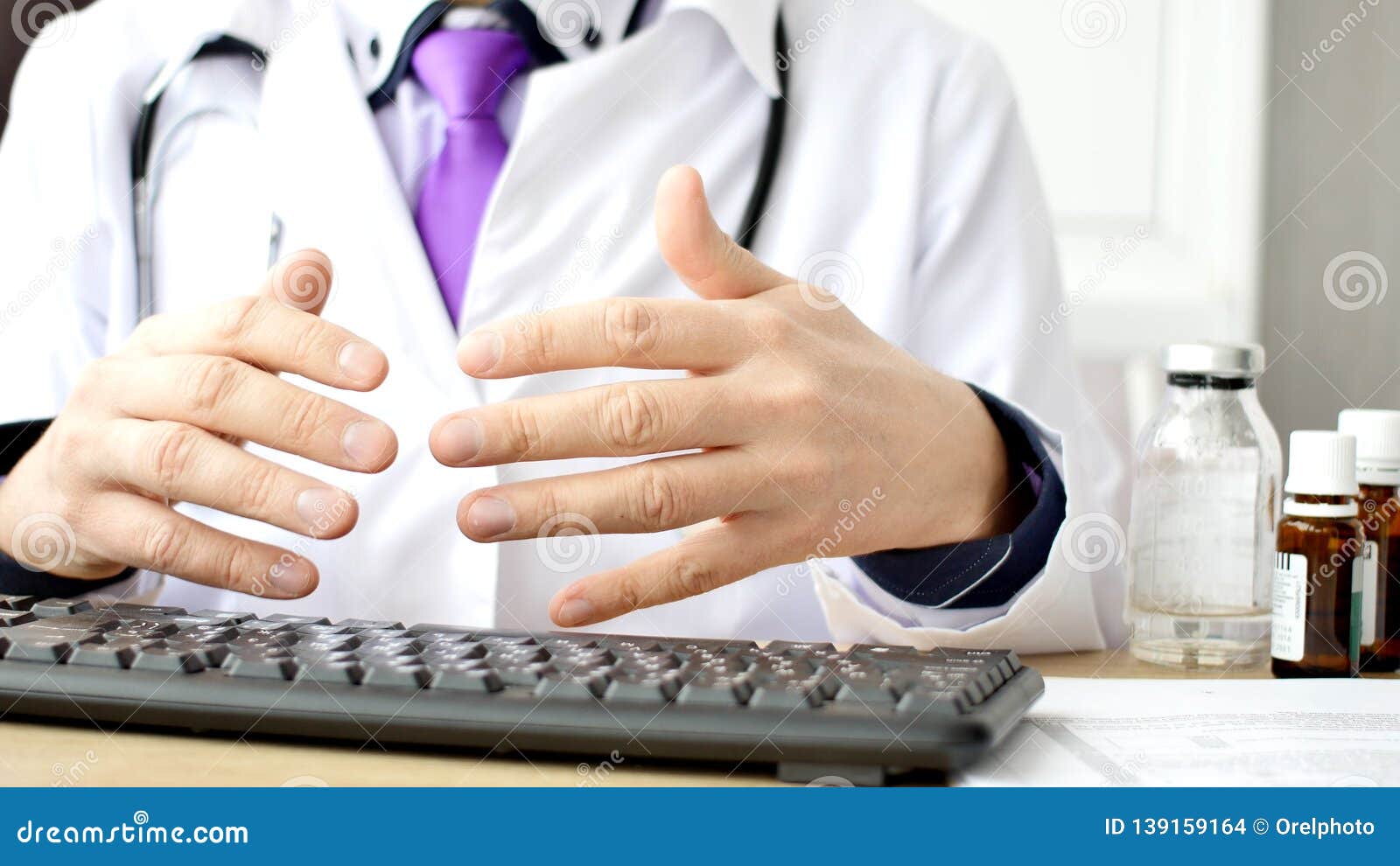 A Doctor Explaining Something by Making Hands Gestures Stock Photo ...