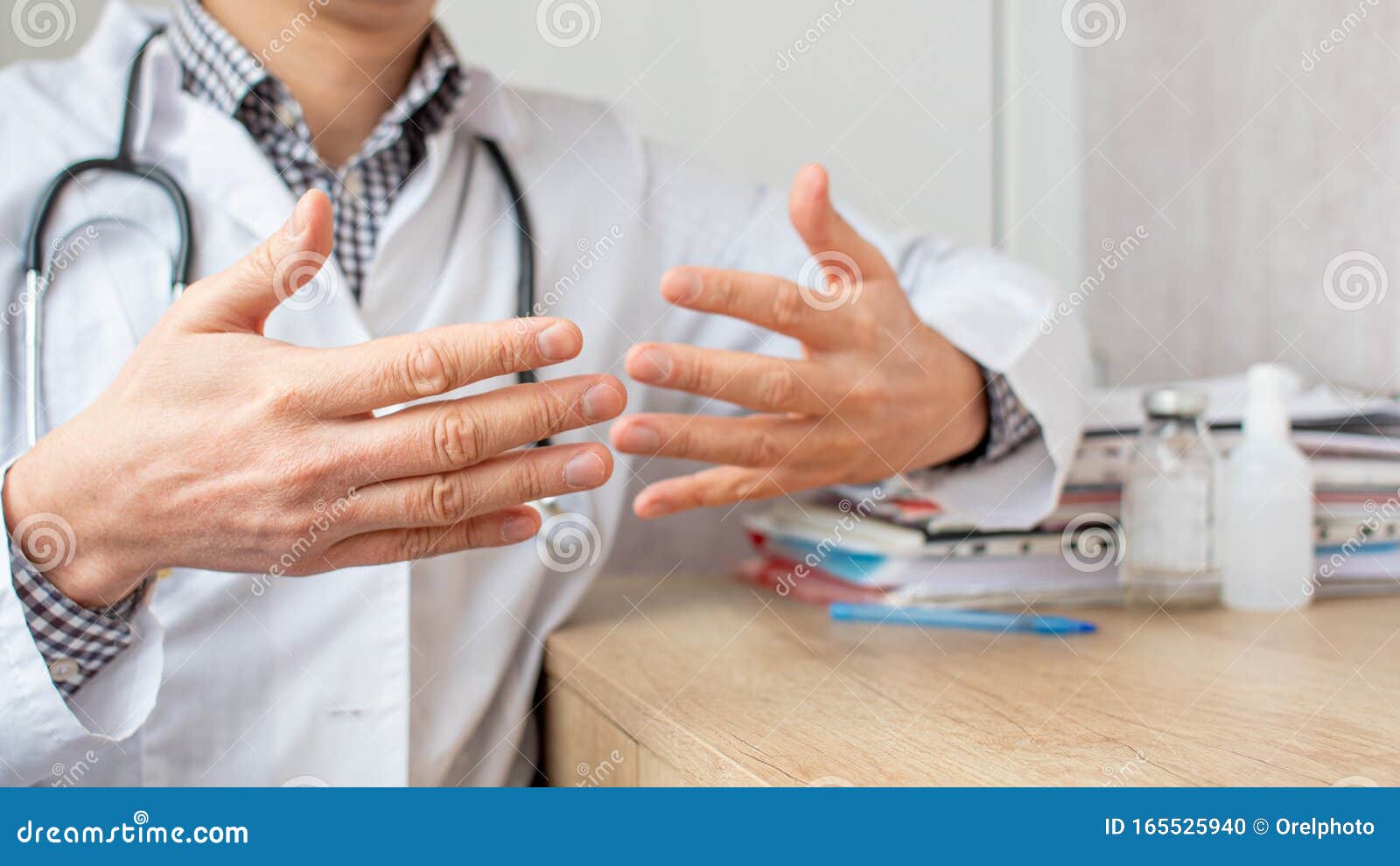 The Doctor Explaining Something for Patient by Making Hands Gestures ...
