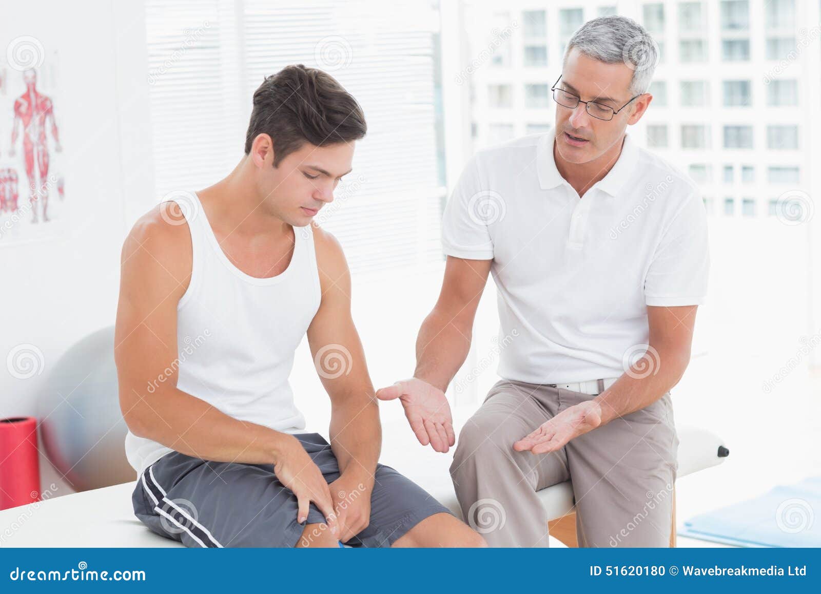 Doctor Explaining Something To His Patient Stock Photo - Image of ...