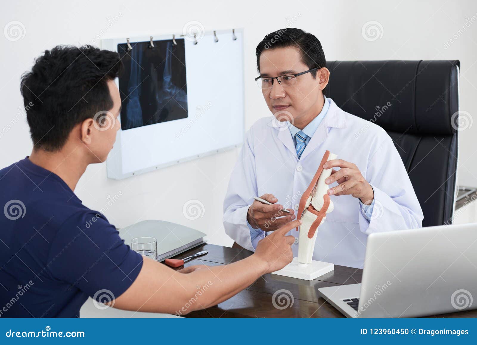 Discussing Structure of Joint Stock Photo - Image of surgeon ...