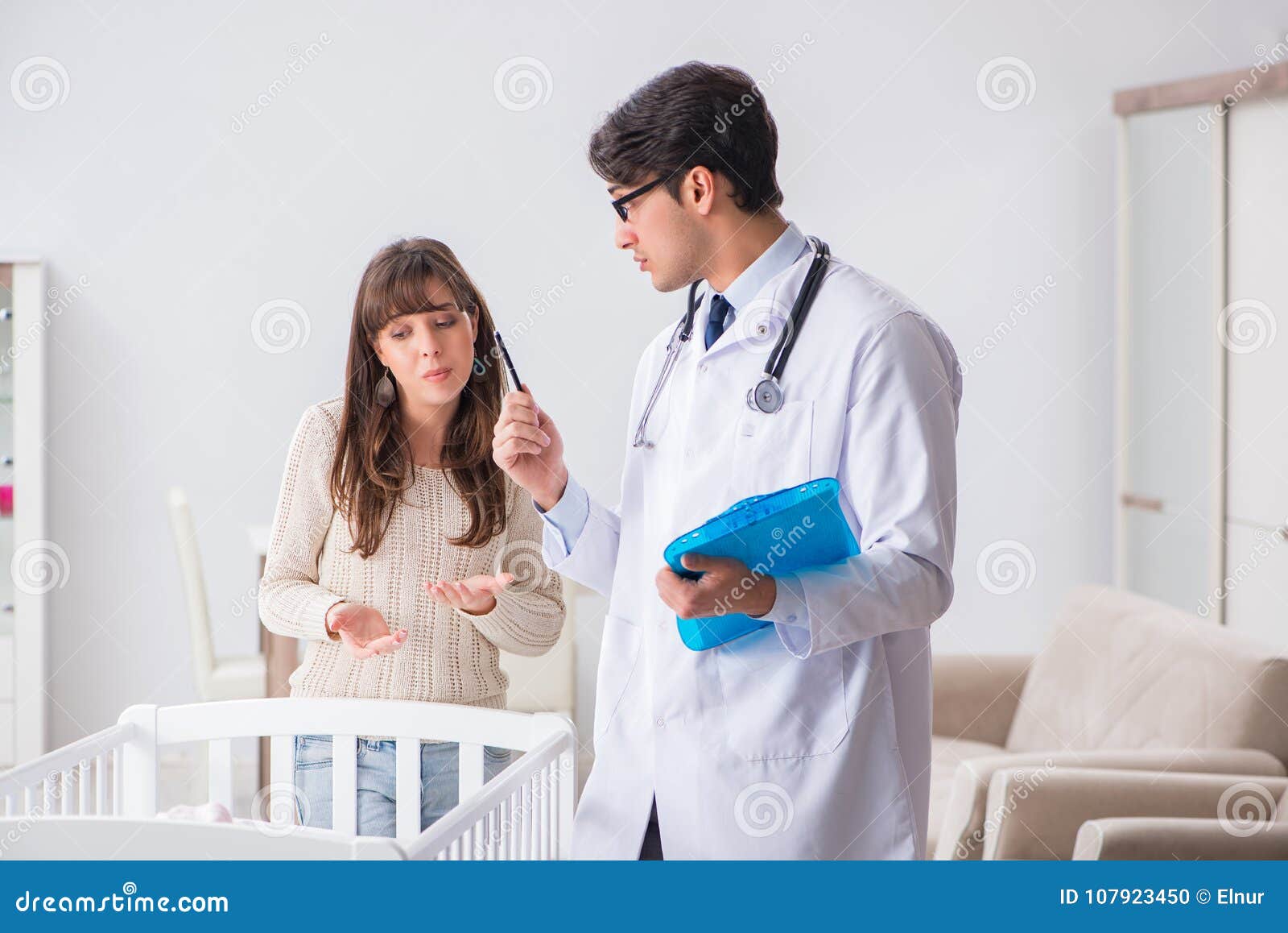 The Doctor Explaining To Young Mother Stock Photo - Image of child ...