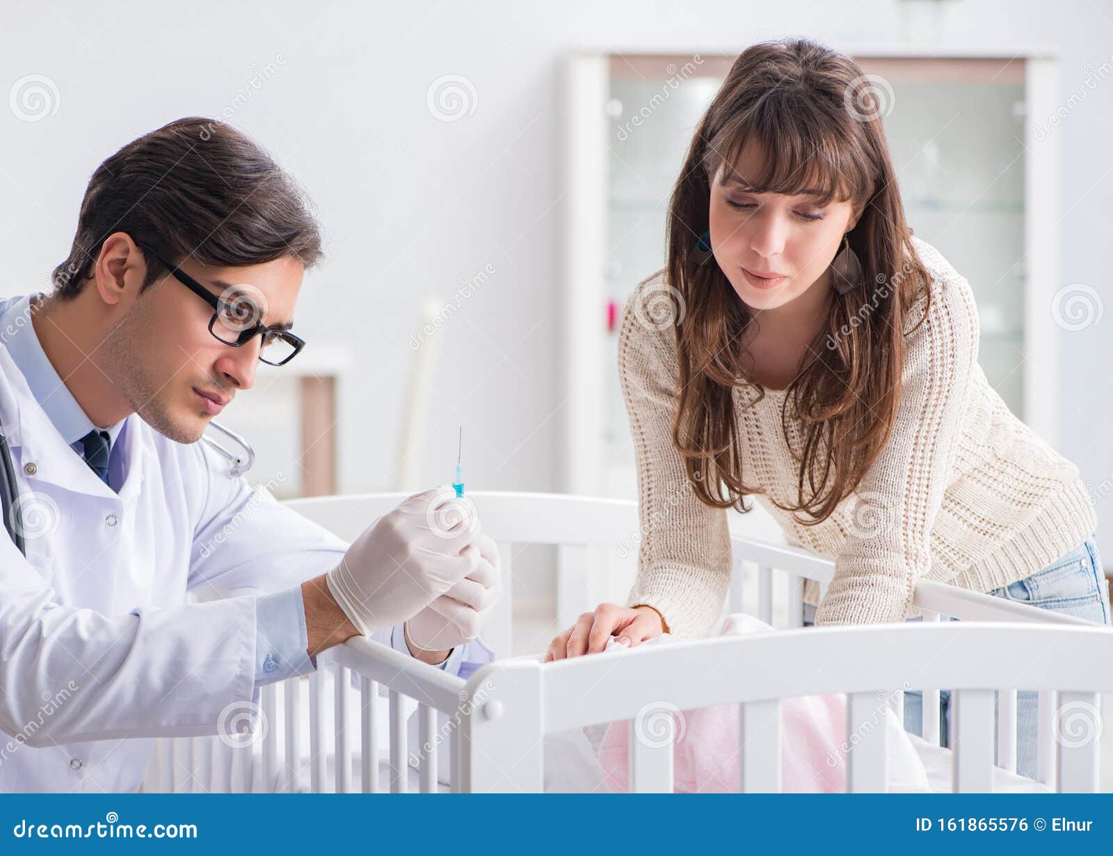 Doctor Explaining To Young Mother Stock Photo - Image of health ...