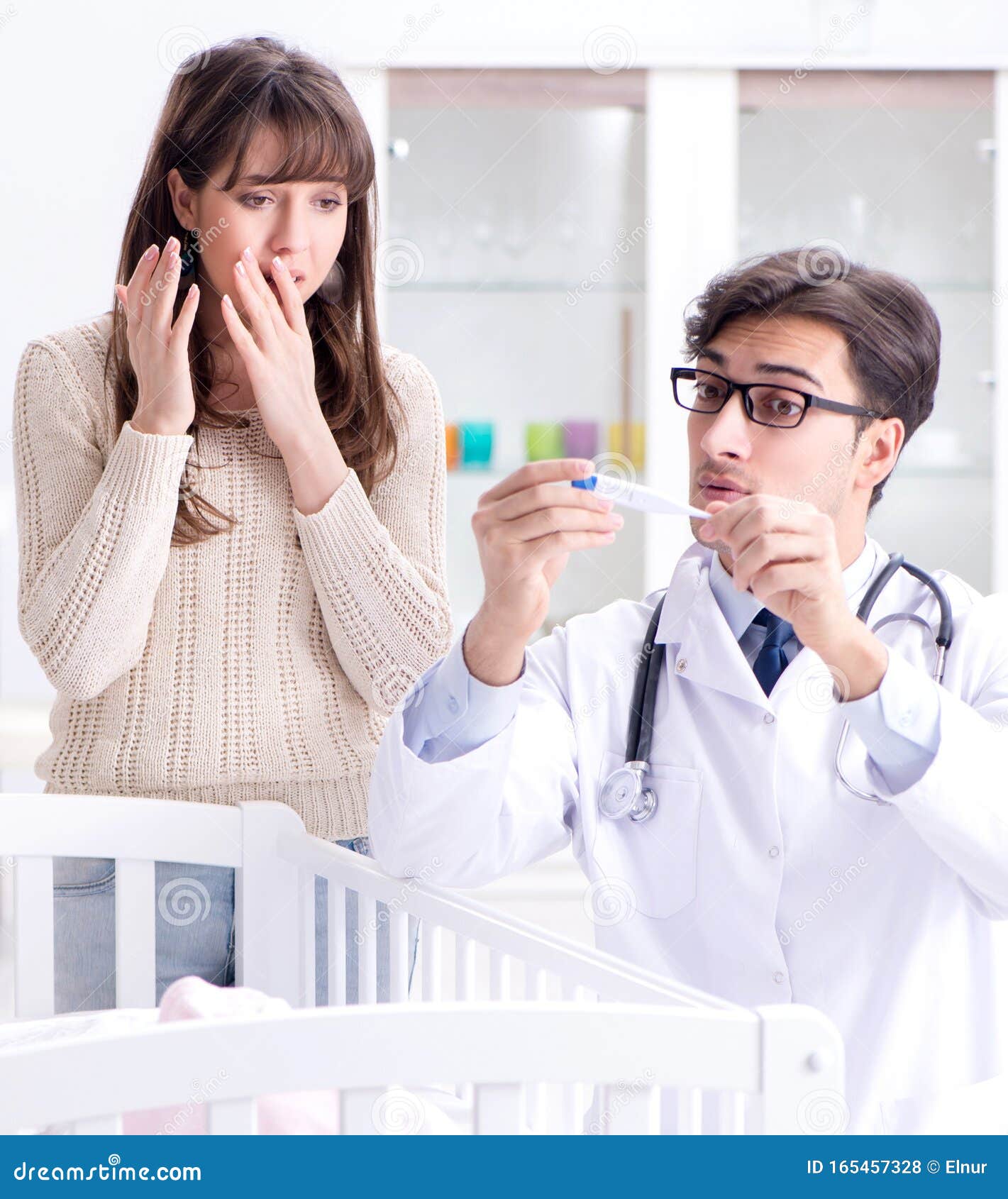 Doctor Explaining To Young Mother Stock Photo - Image of fever ...