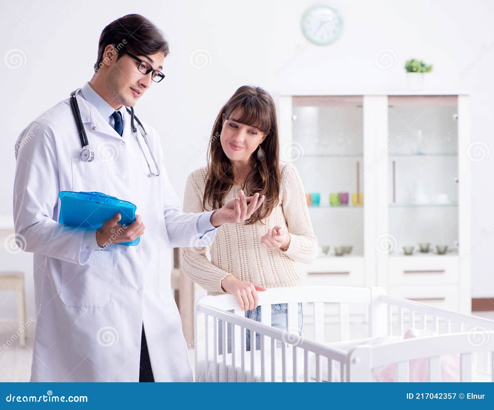 Doctor Explaining To Young Mother Stock Image - Image of little ...