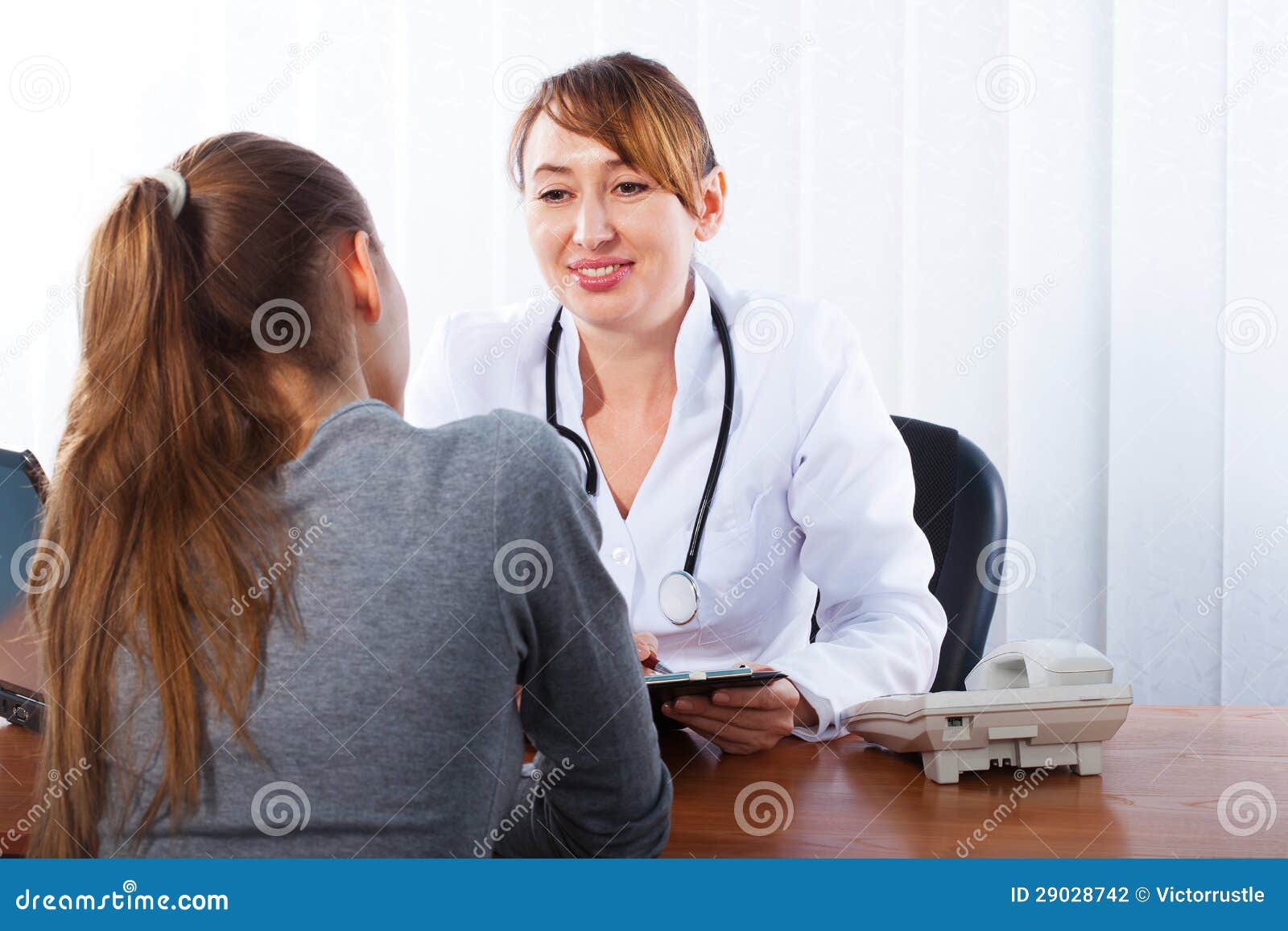 Doctor with female patient stock photo. Image of person - 29028742