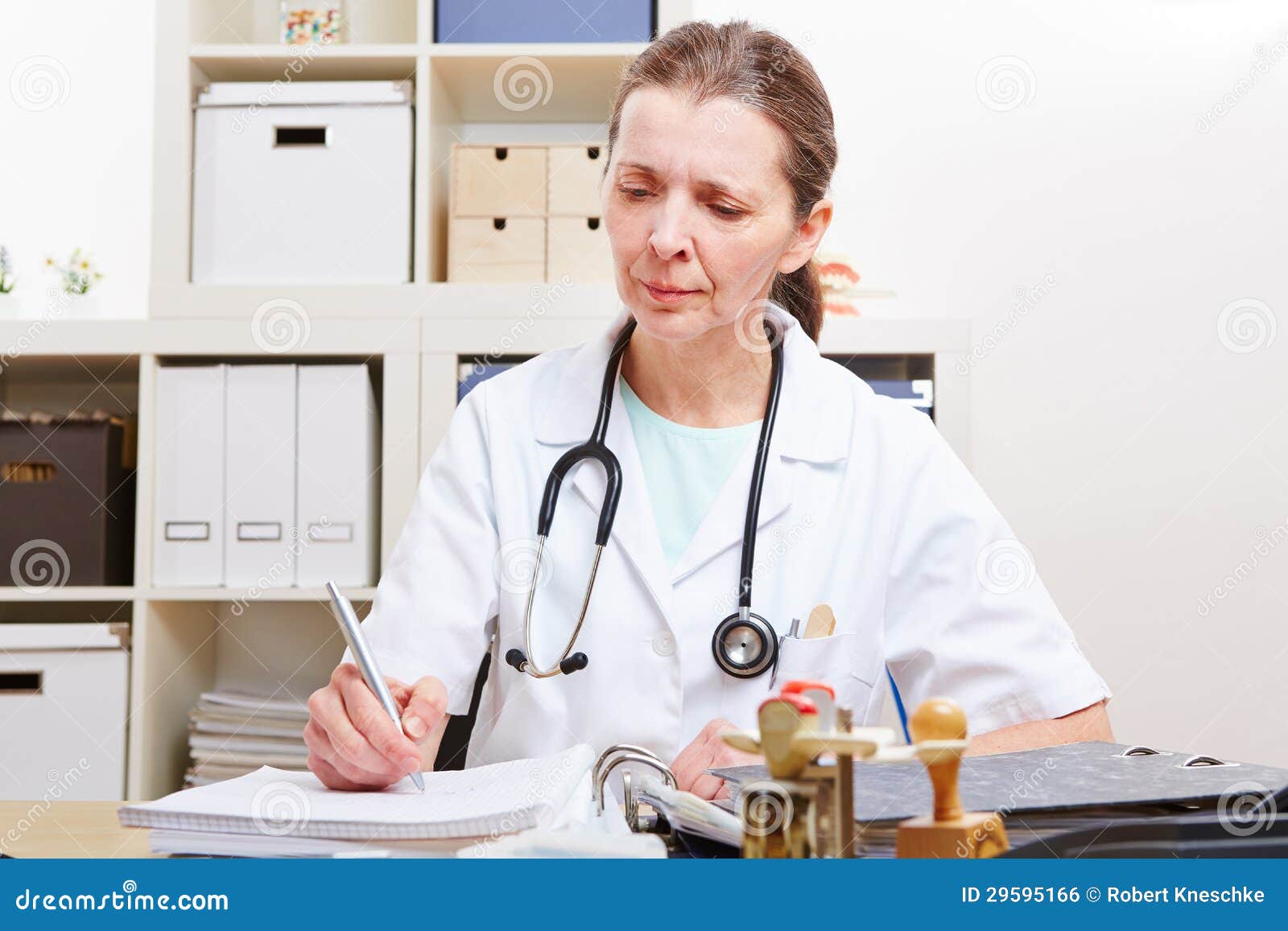 Doctor with Files in Her Office Stock Photo - Image of desk ...