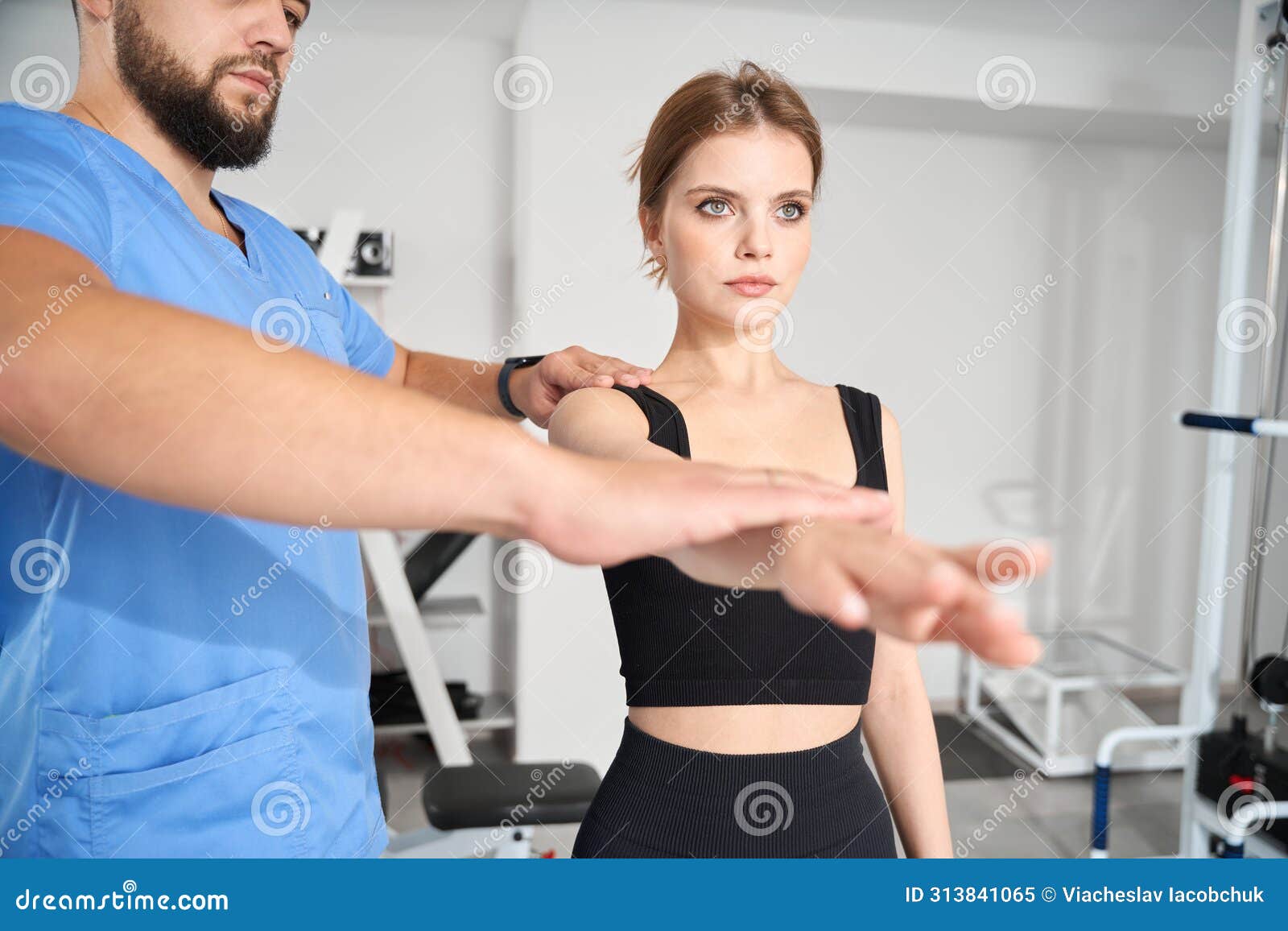 Doctor Forms the Correct Posture for a Young Patient Stock Image ...
