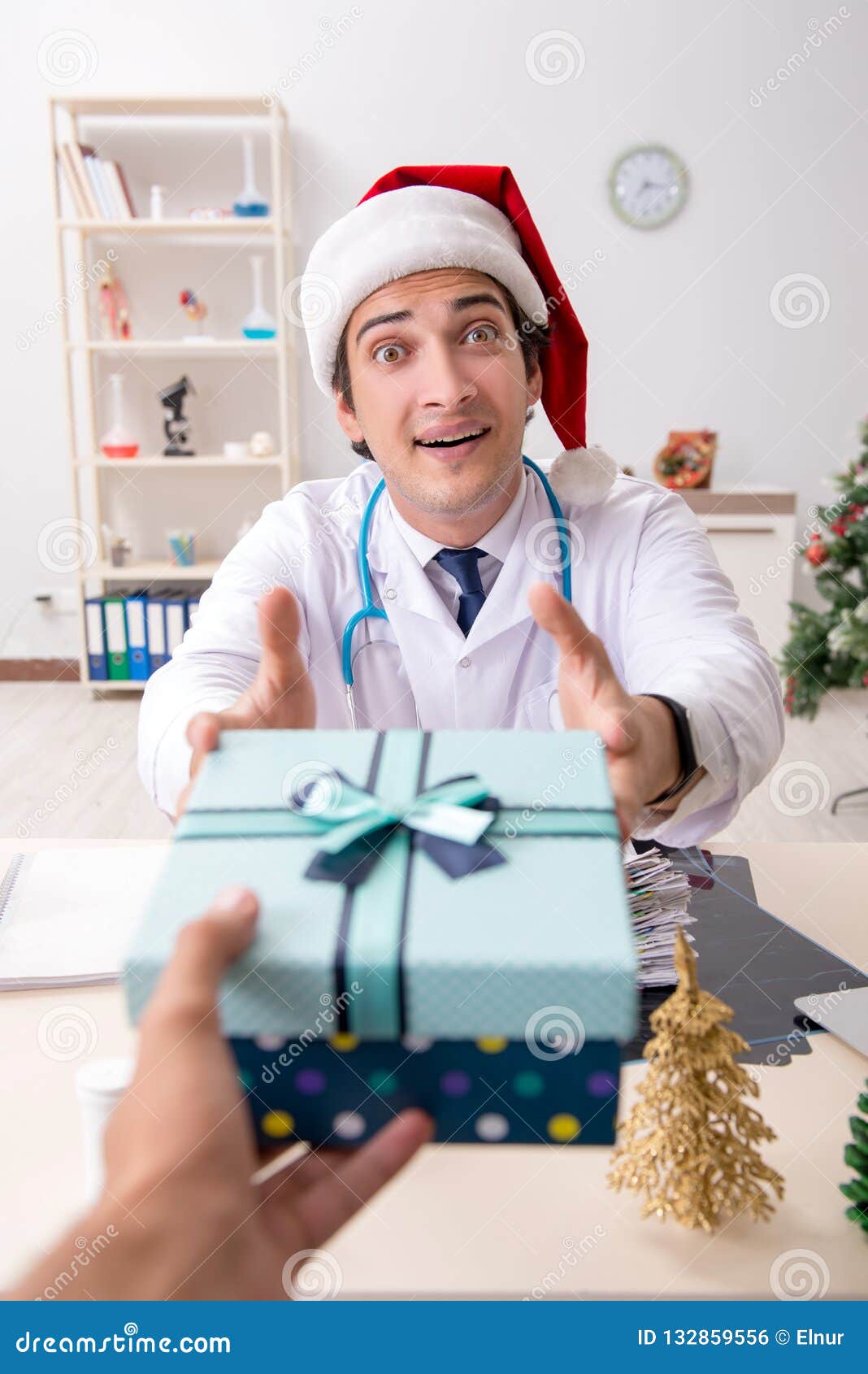 The Doctor with Gift Box in the Hospital Stock Photo - Image of intern ...