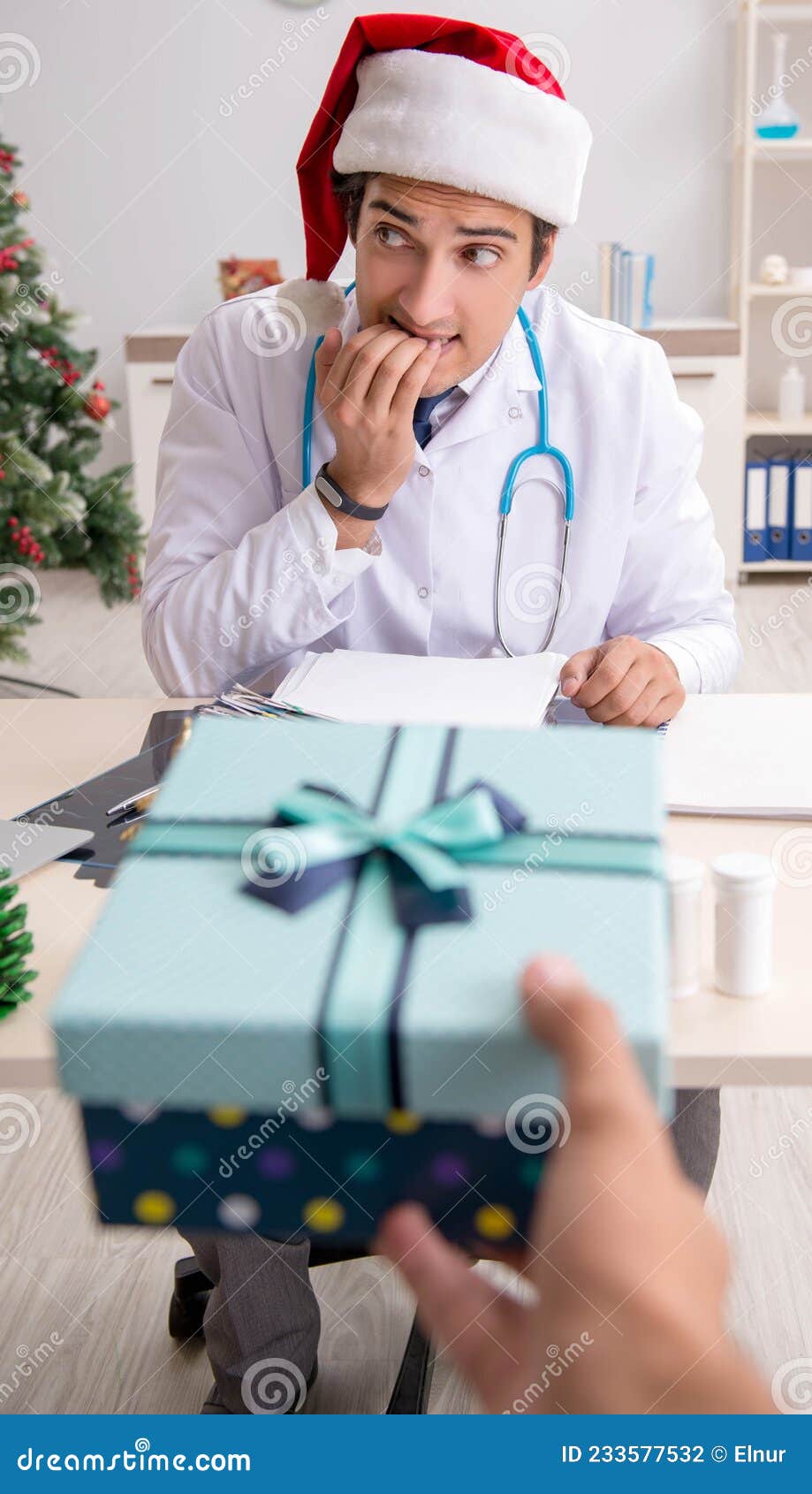 Doctor with Gift Box in the Hospital Stock Photo - Image of exchanging ...