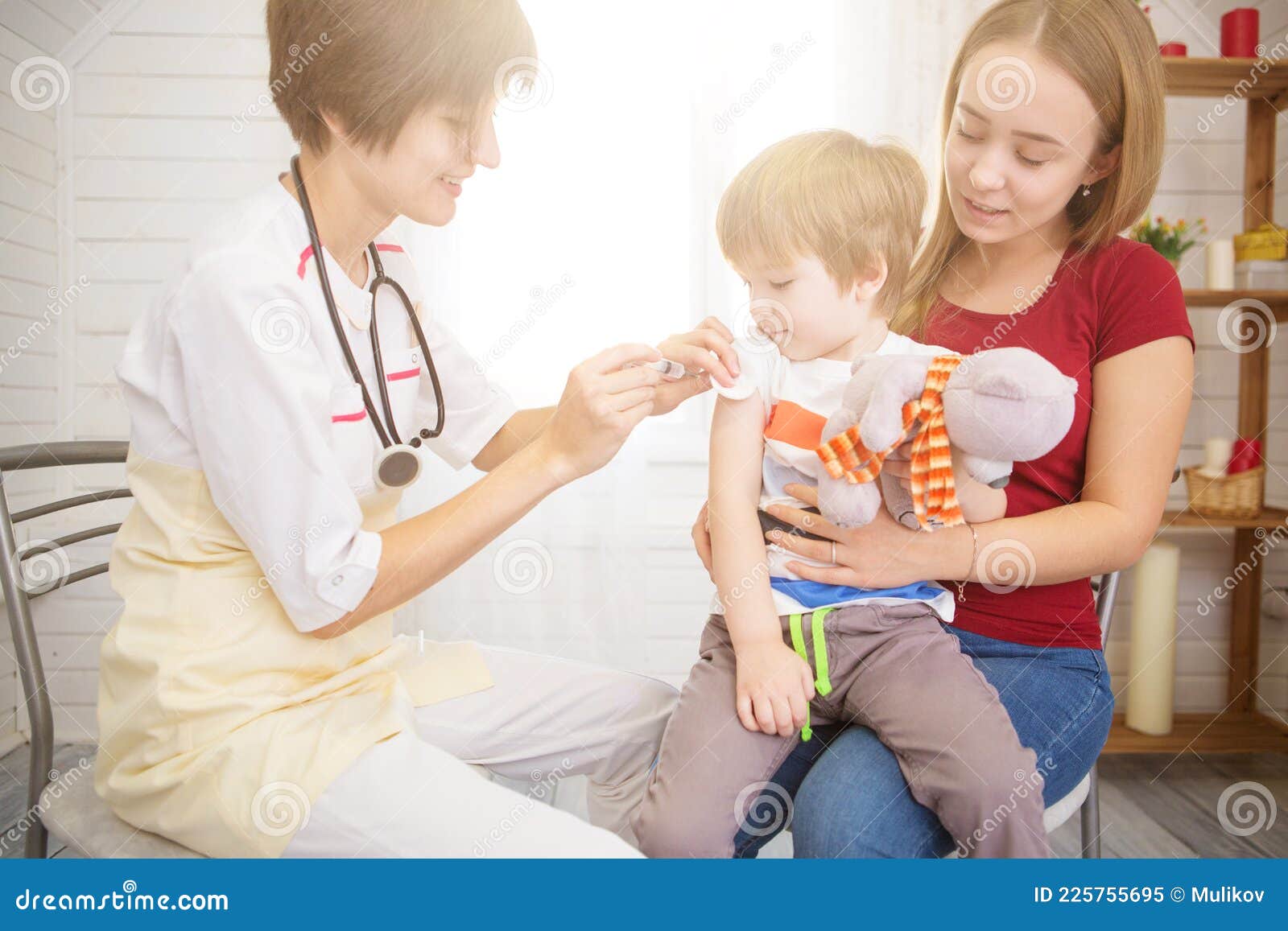A Doctor Giving a Child an Injection at Home Stock Image - Image of ...