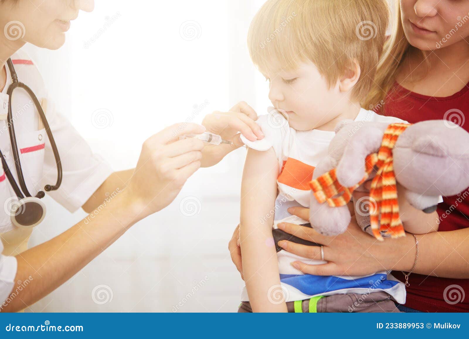 A Doctor Giving a Child an Injection at Home Stock Image - Image of ...