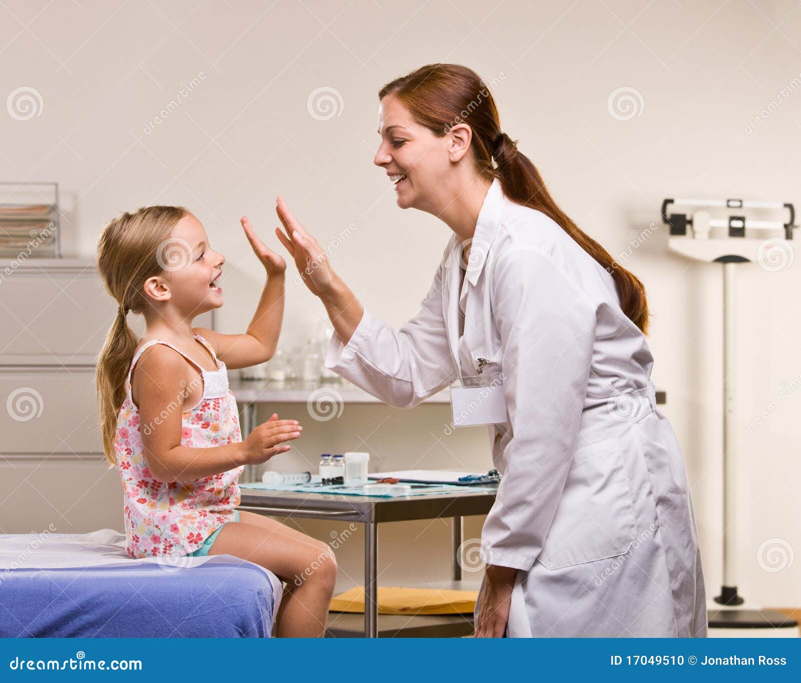 Doctor Giving Girl High-five Stock Photo - Image of female, caucasian ...