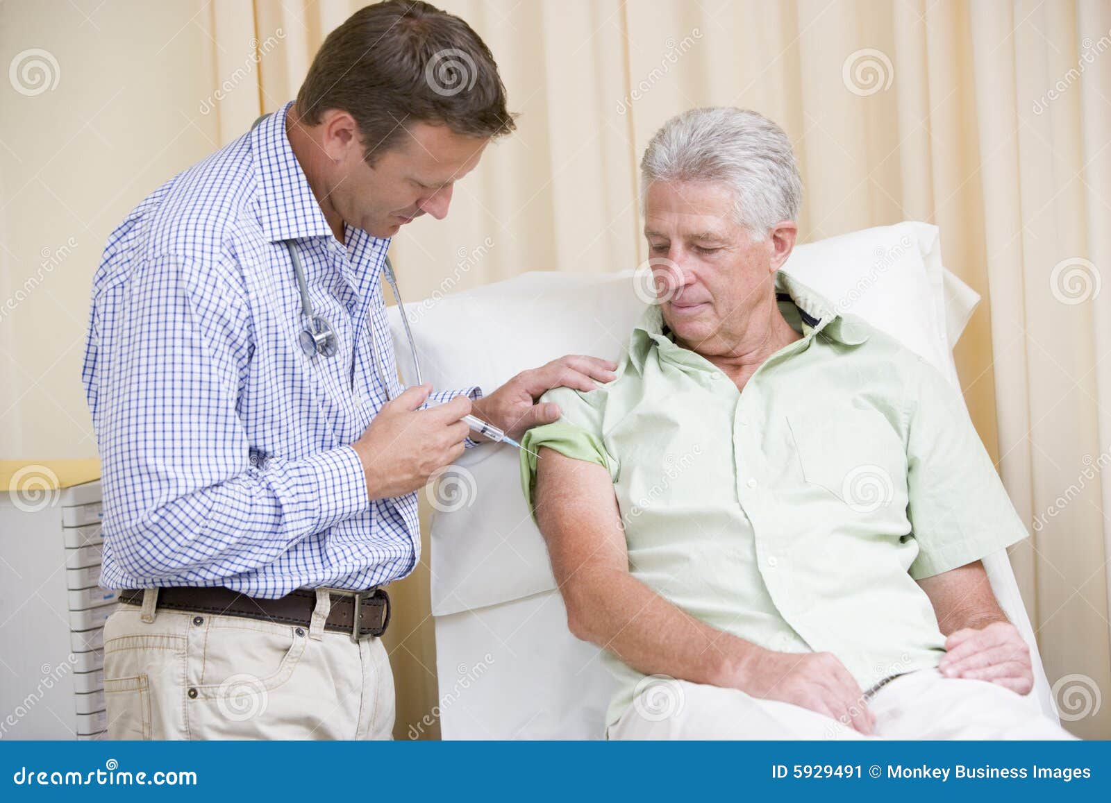 Doctor Giving Man Needle in Exam Room Stock Image - Image of ...