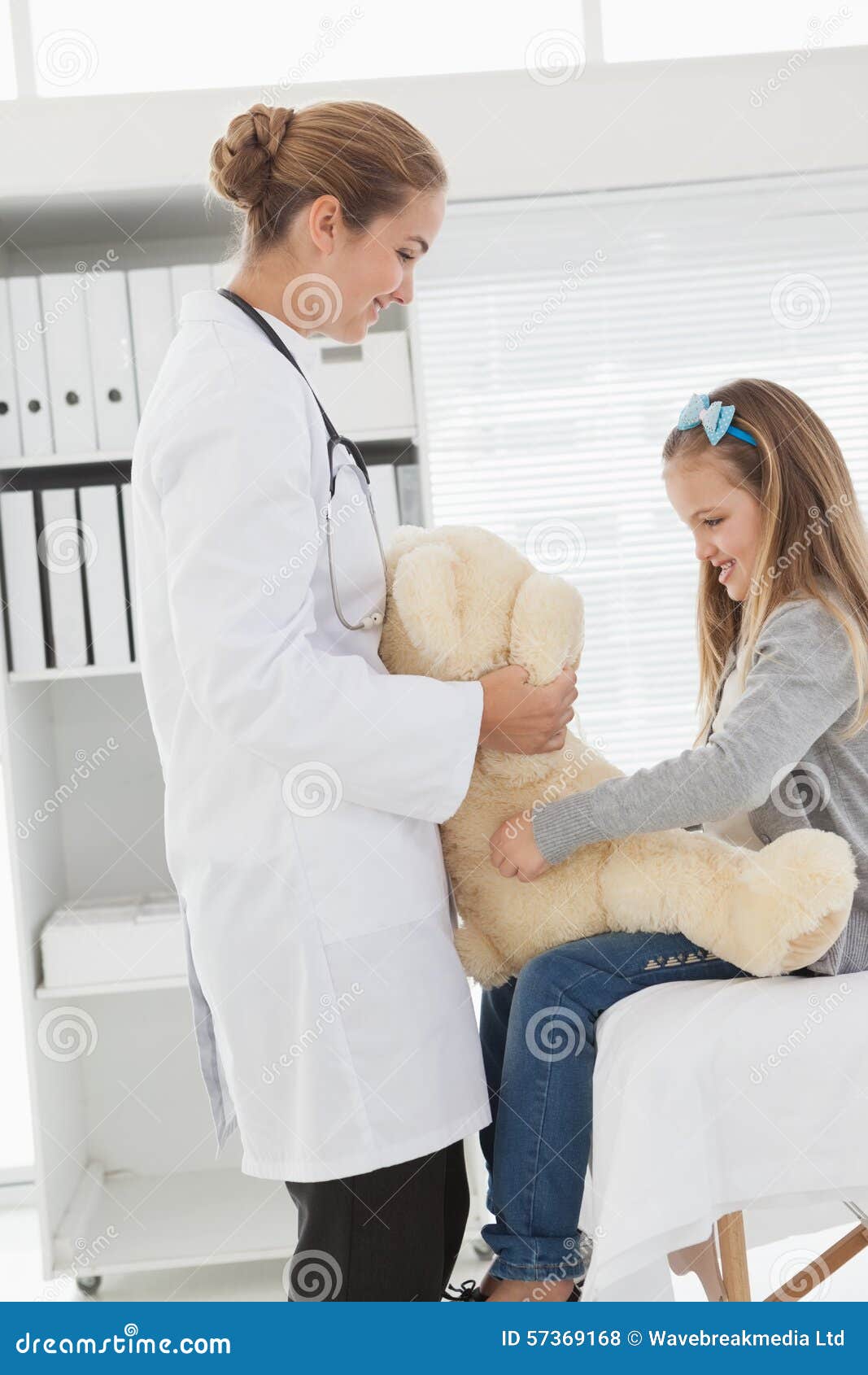 Doctor Giving a Patient a Stuffed Bear Stock Photo - Image of adult ...