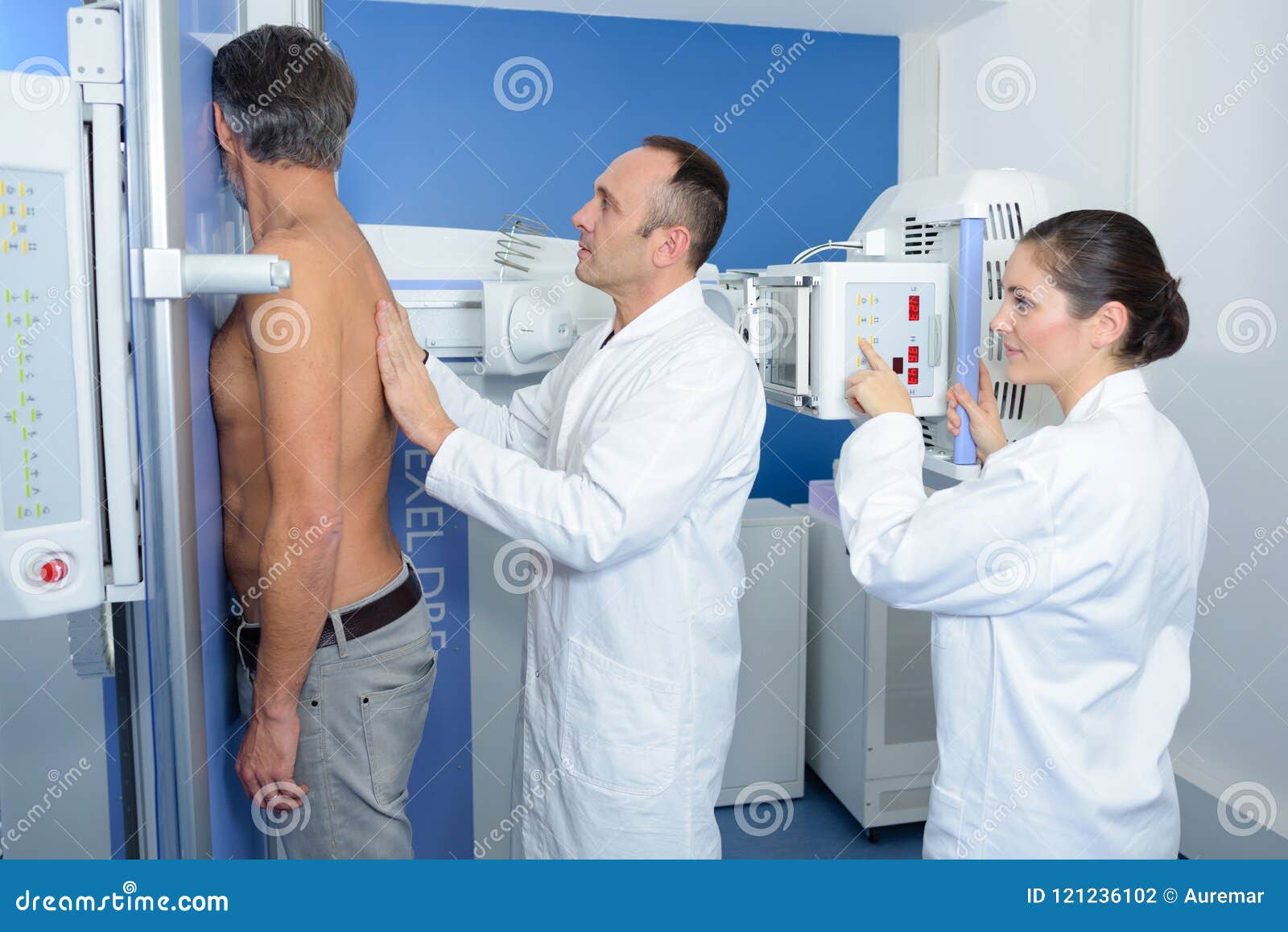 Doctor Guiding Patient for Xray Stock Photo - Image of specialist ...