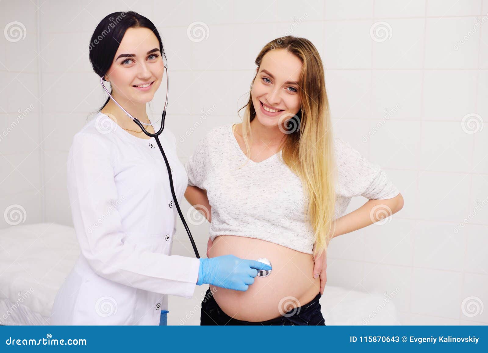Doctor Gynecologist Examines A Pregnant Woman With A Large Belly Stock