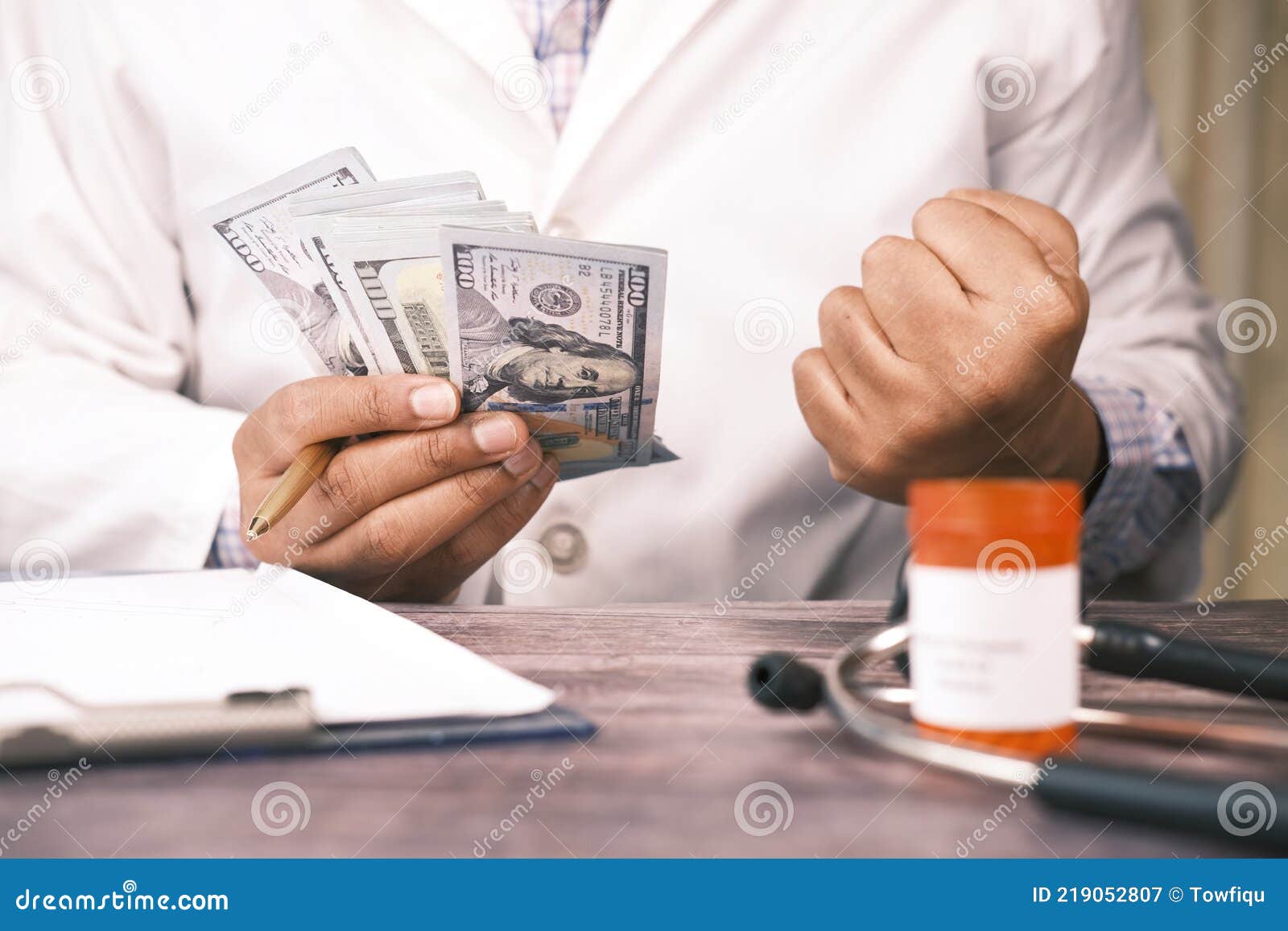 Doctor Hand Counting Cash with Pill Container on Table Stock Image ...