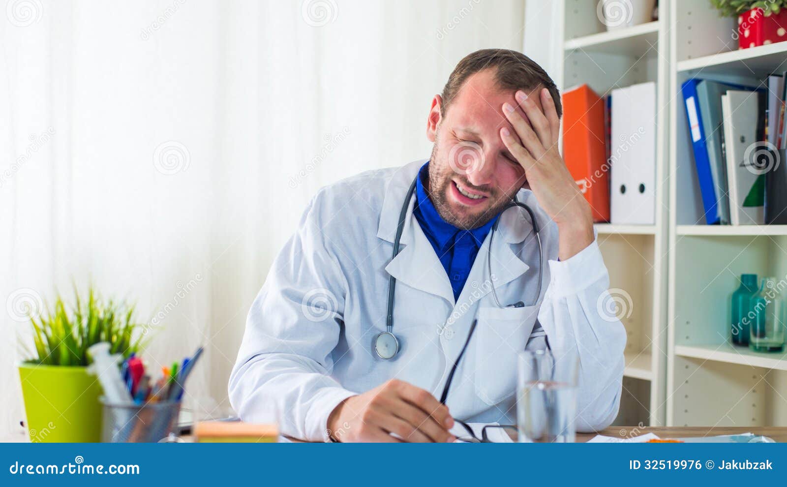 Doctor having a headache. stock photo. Image of headache - 32519976
