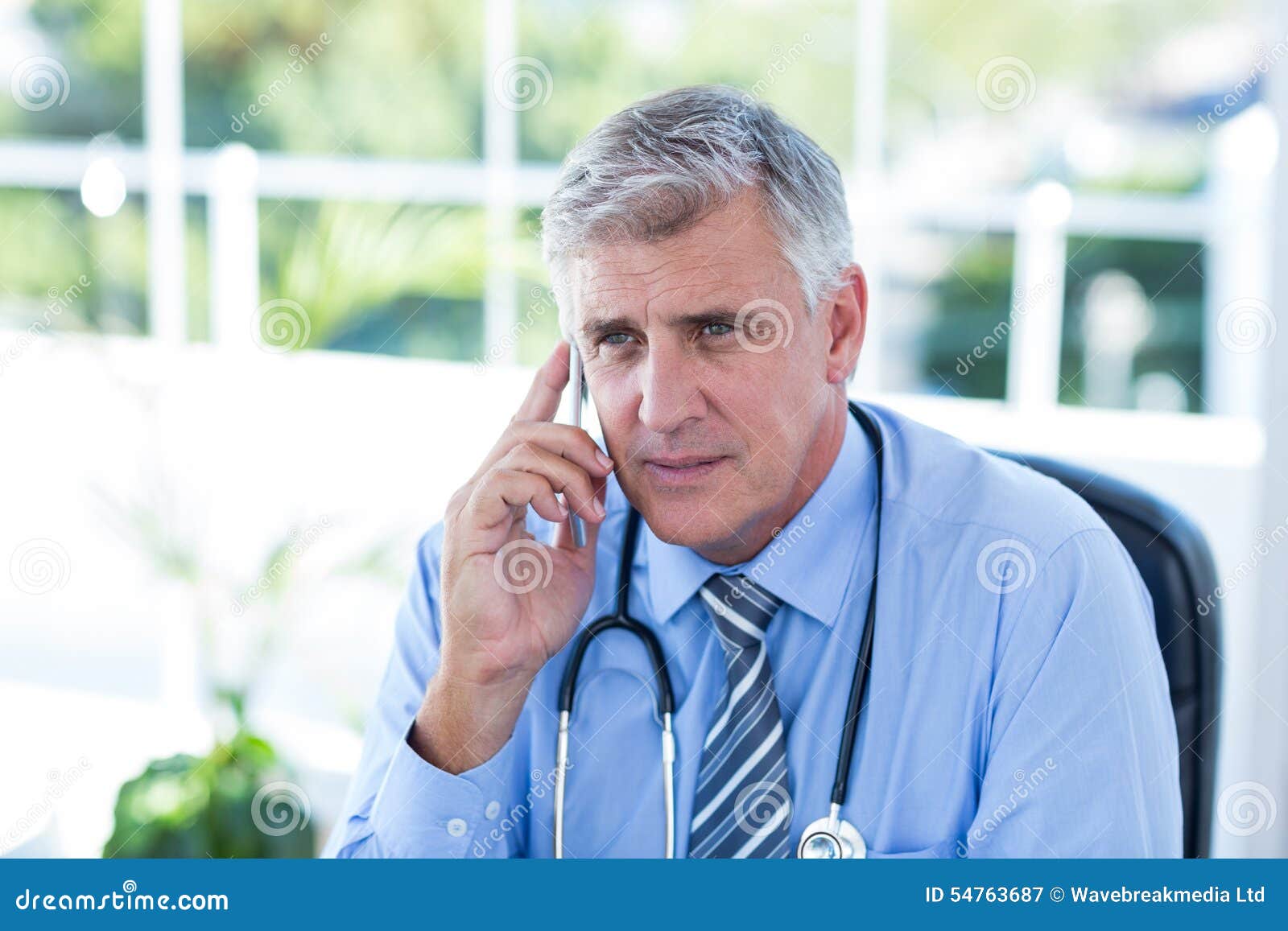 Doctor having phone call stock image. Image of adult - 54763687