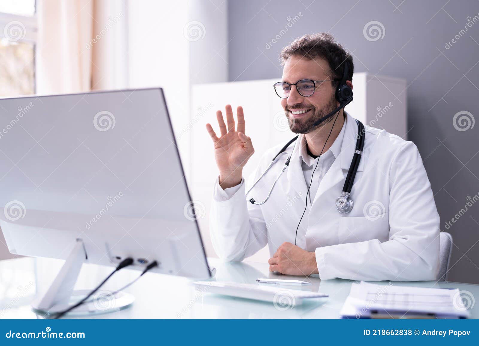 Doctor Having Video Conference on Computer Stock Photo - Image of desk ...