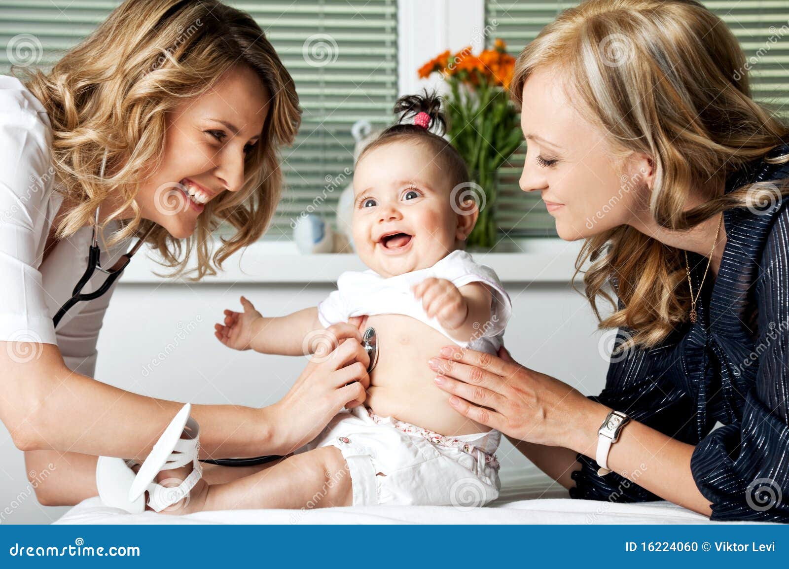 Woman Doctor with Mother and Baby Stock Photo - Image of smiling, young ...