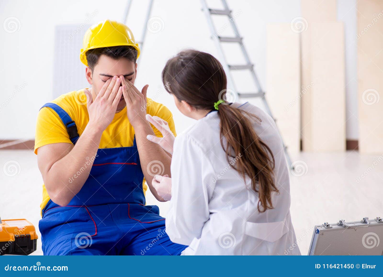 The Doctor Helping Injured Worker at Construction Site Stock Photo ...