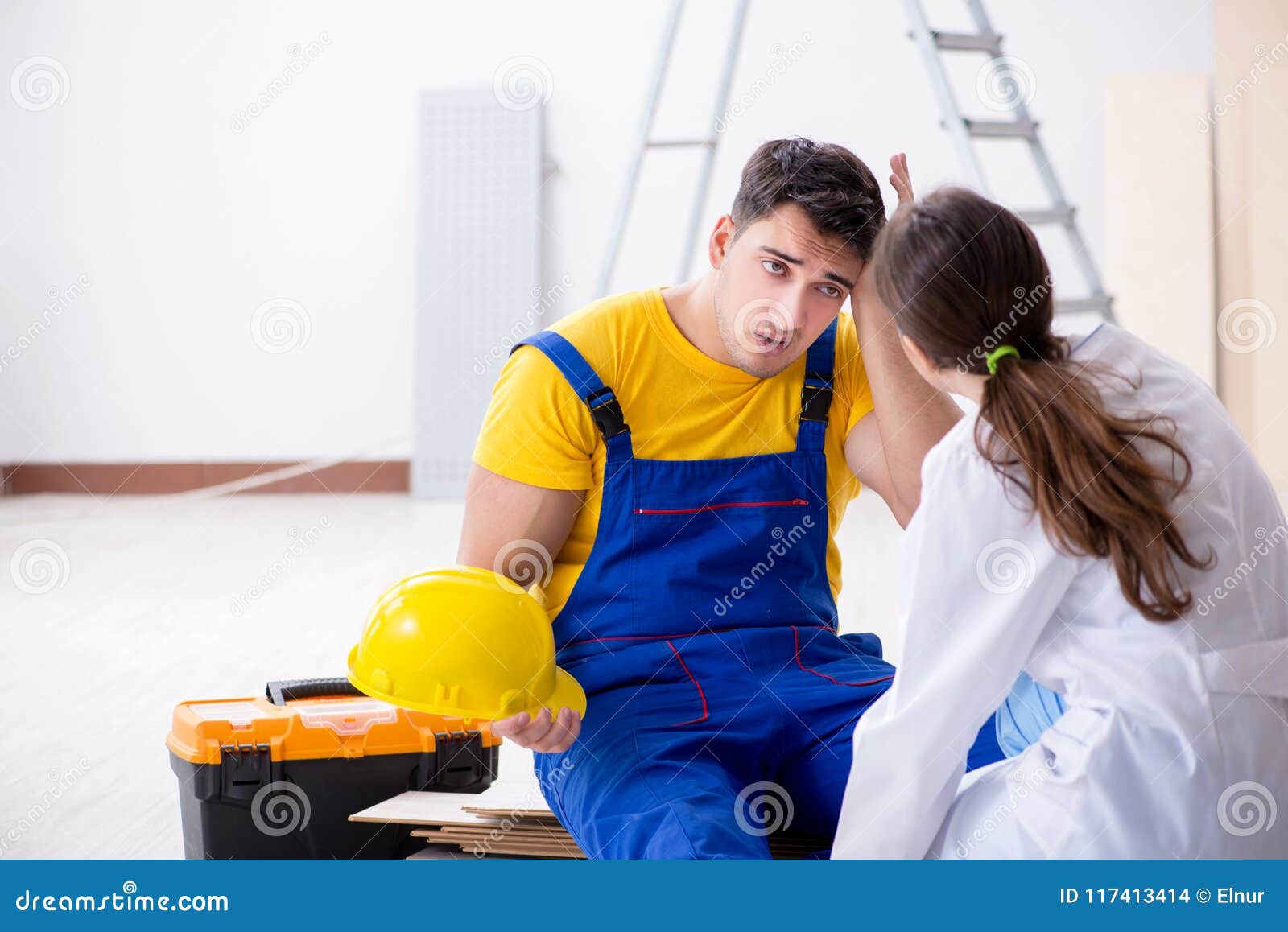 The Doctor Helping Injured Worker at Construction Site Stock Photo ... The Doctor Helping Injured Worker at Construction Site Stock Photo ...