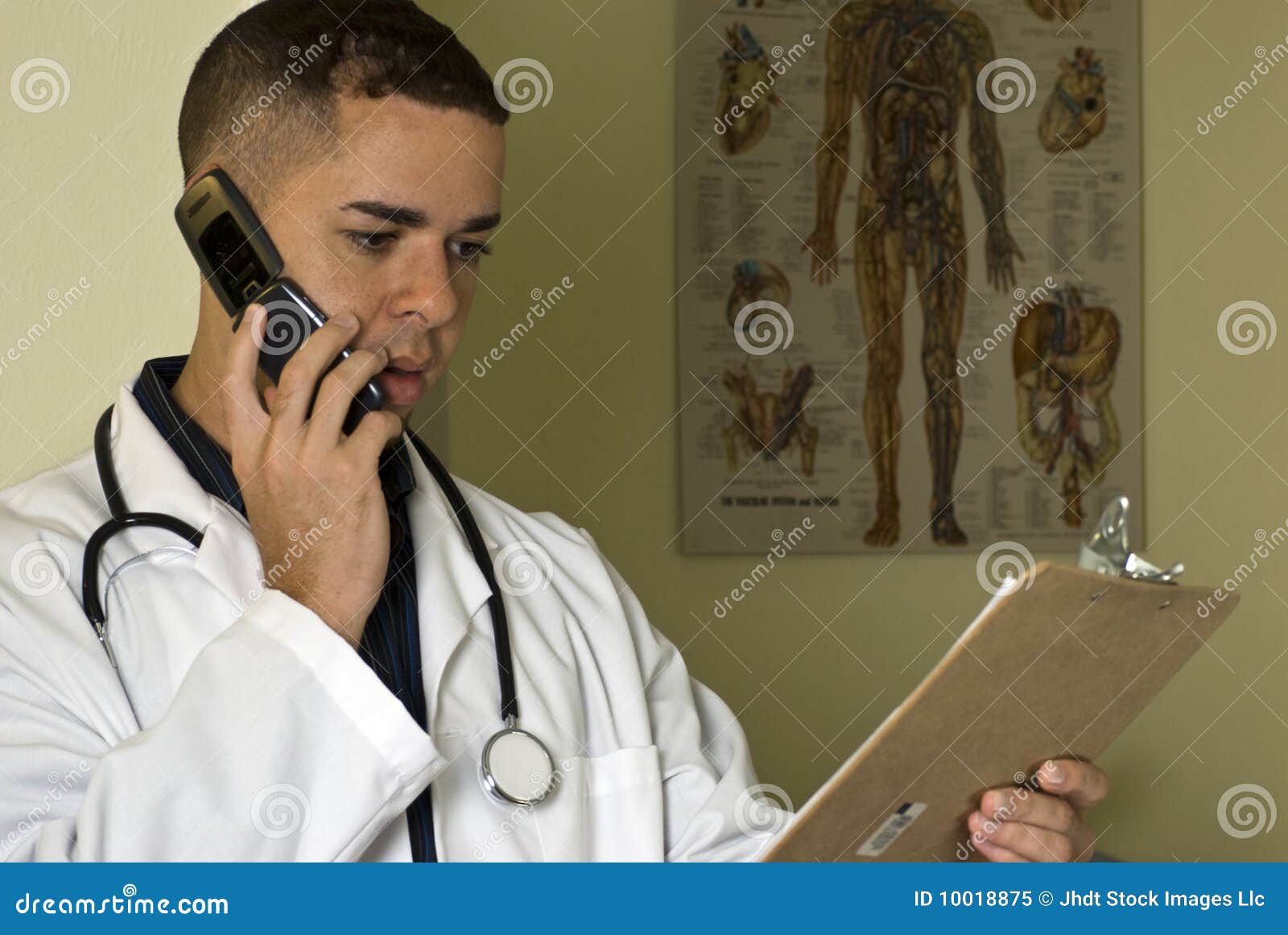 Doctor on his Cell Phone stock image. Image of technology - 10018875