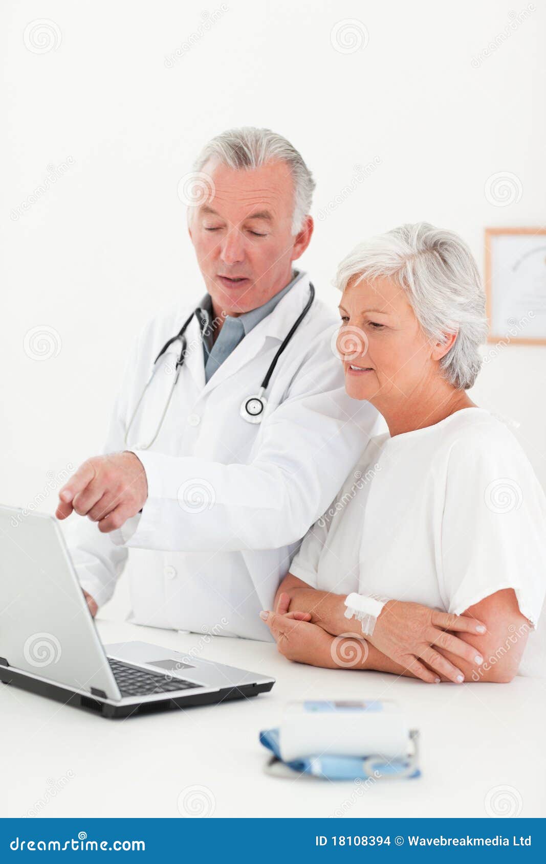 Doctor and His Patient Looking at the Laptop Stock Photo - Image of ...