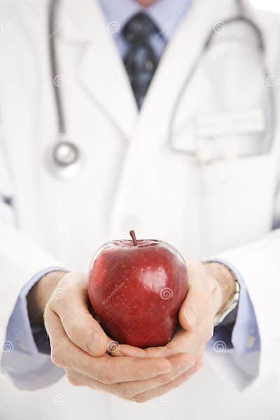 Doctor holding apple. stock photo. Image of diet, health - 2431968