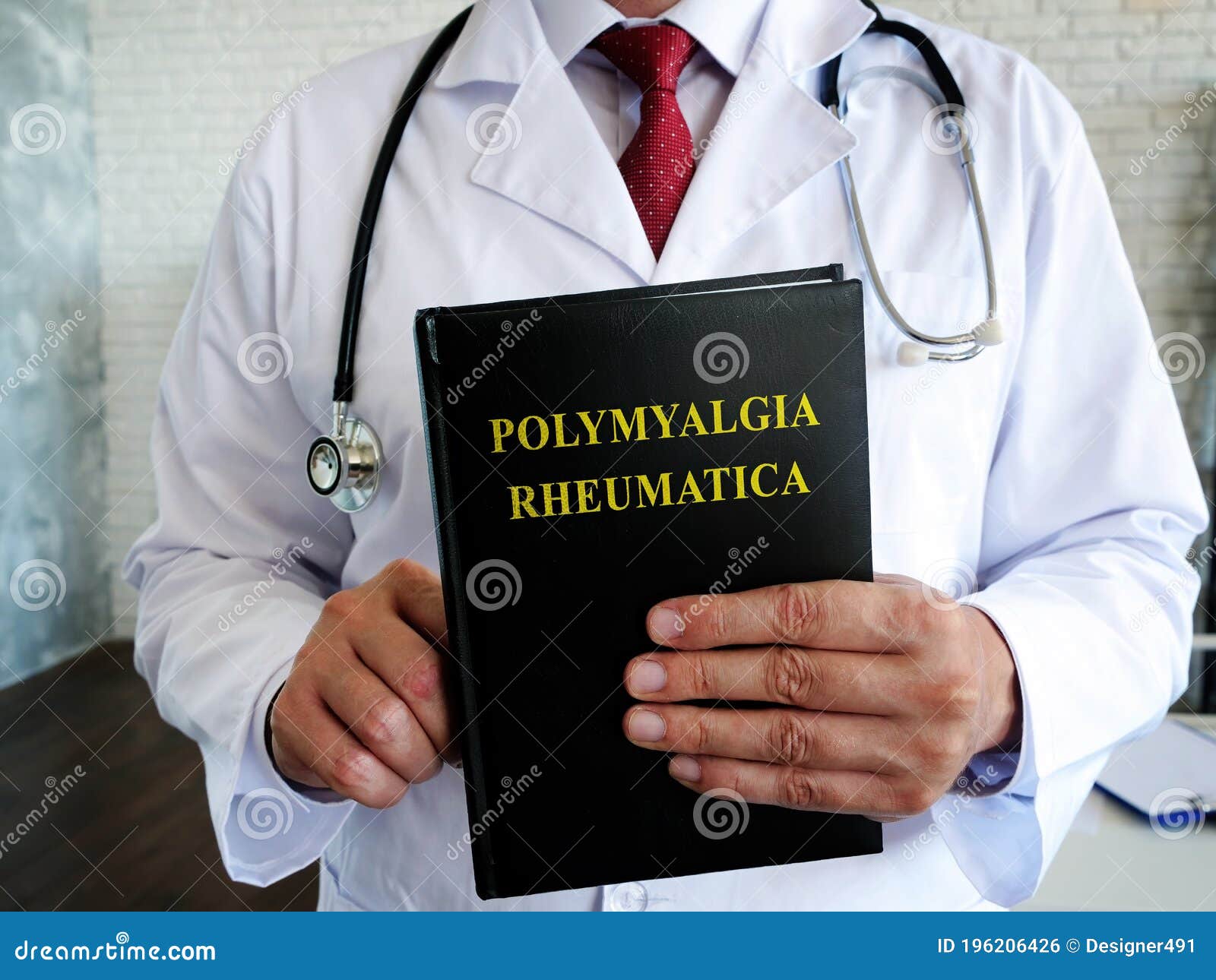 Doctor is Holding a Book about the Polymyalgia Rheumatica Disease ...