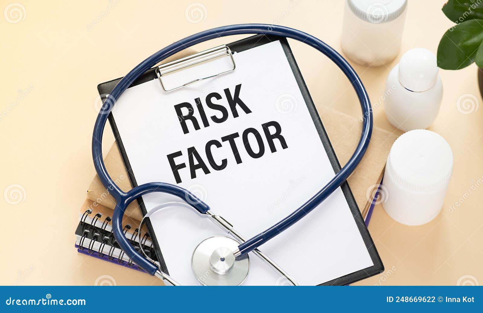 Doctor Holding a Card with Text RISK FACTOR, Medical Concept Stock ...
