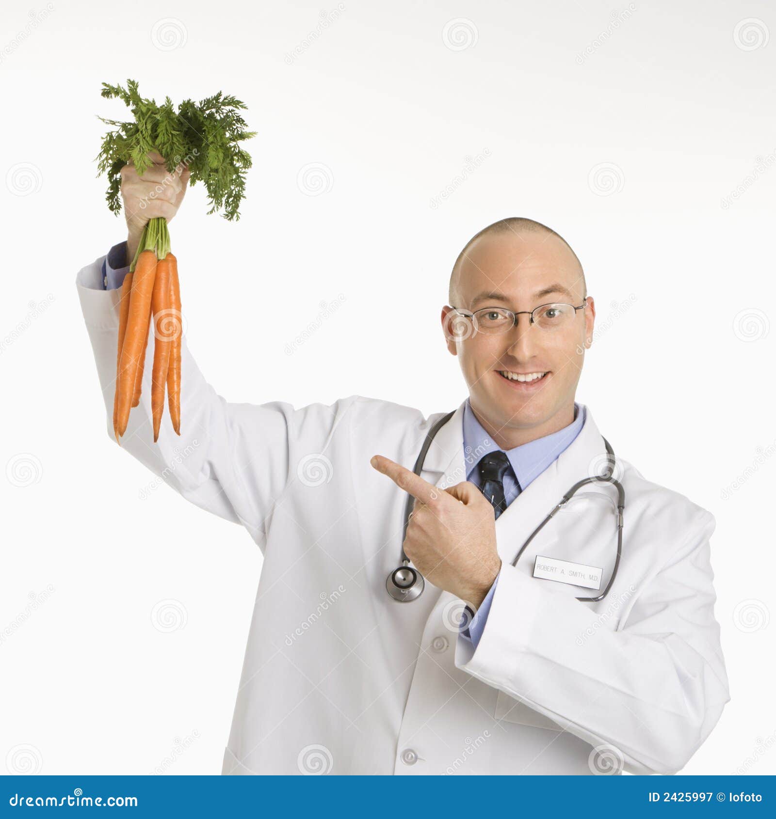 Doctor holding carrots. stock image. Image of health, doctor - 2425997